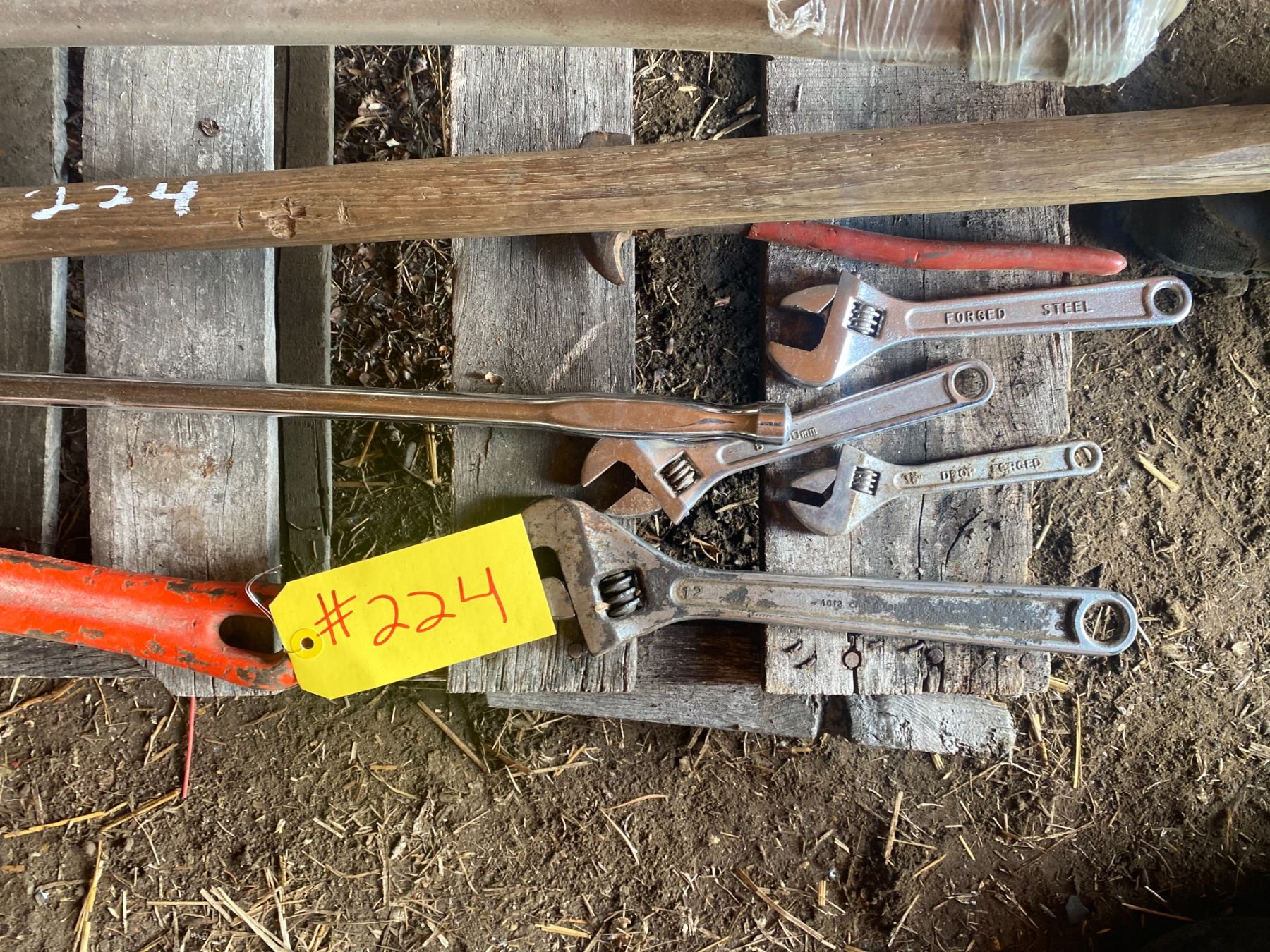 4- Crescents, flex bar, pipe wrench, new sythe, sledge hammer]