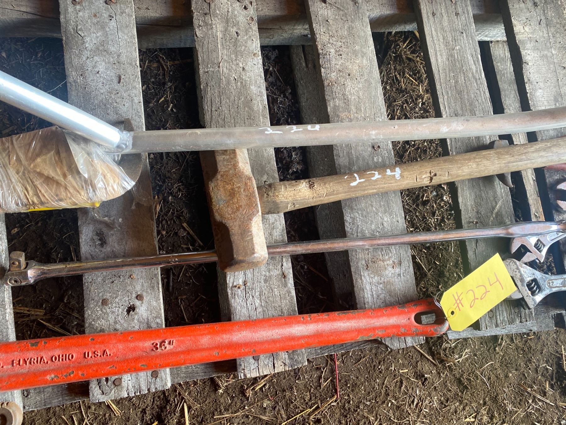 4- Crescents, flex bar, pipe wrench, new sythe, sledge hammer]