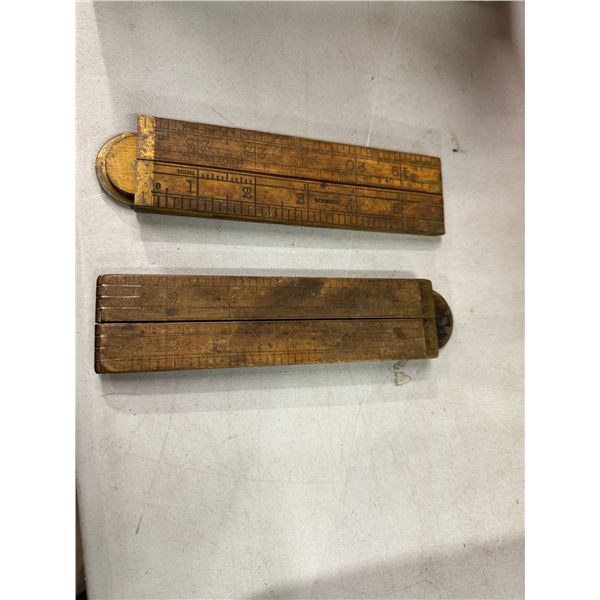 Wood measuring sticks with levels