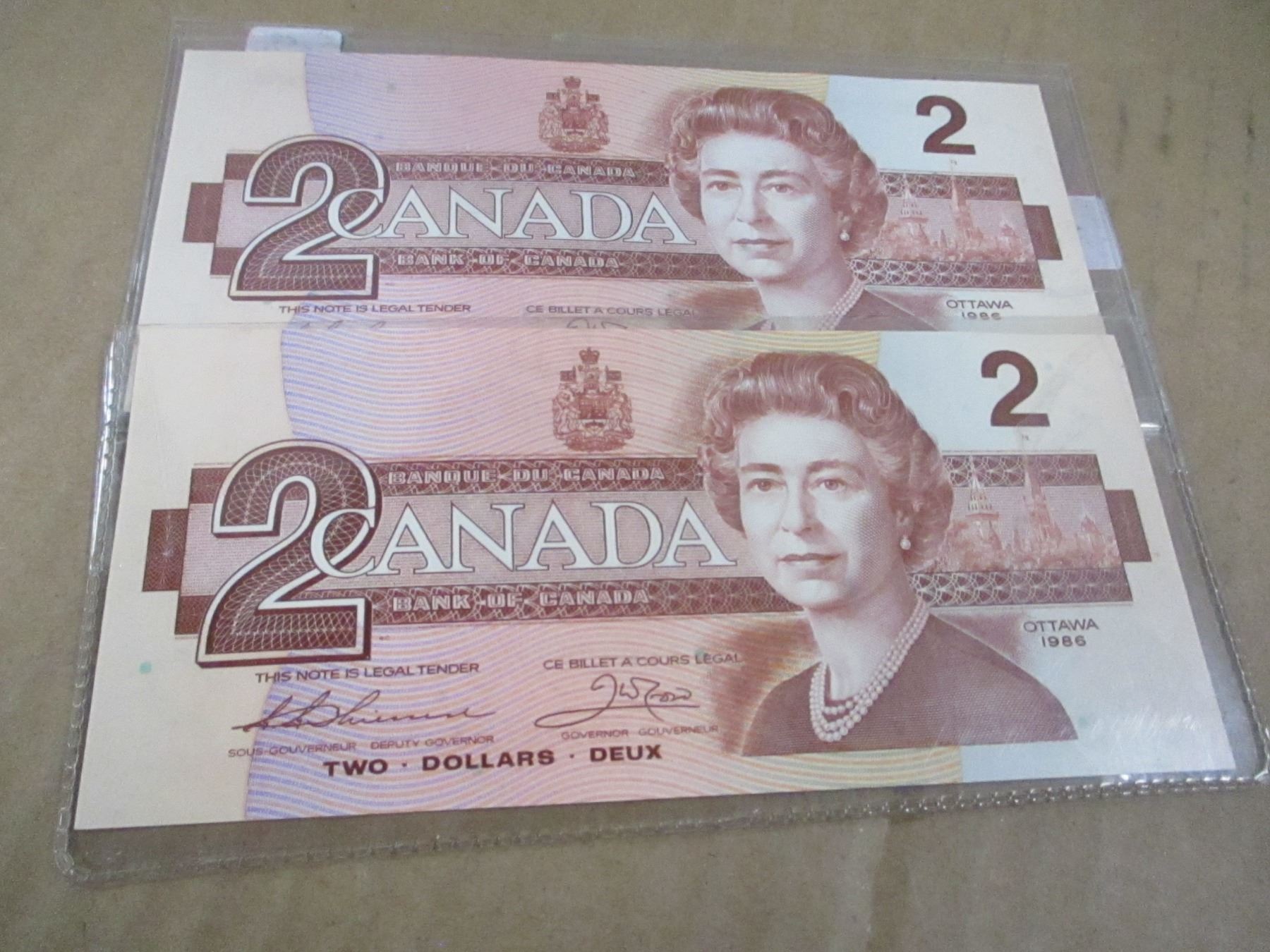 1986 SET OF 2 SEQUENTIAL SERIAL NUMBER UNCIRCULATED CANADA $2 BANK NOTES