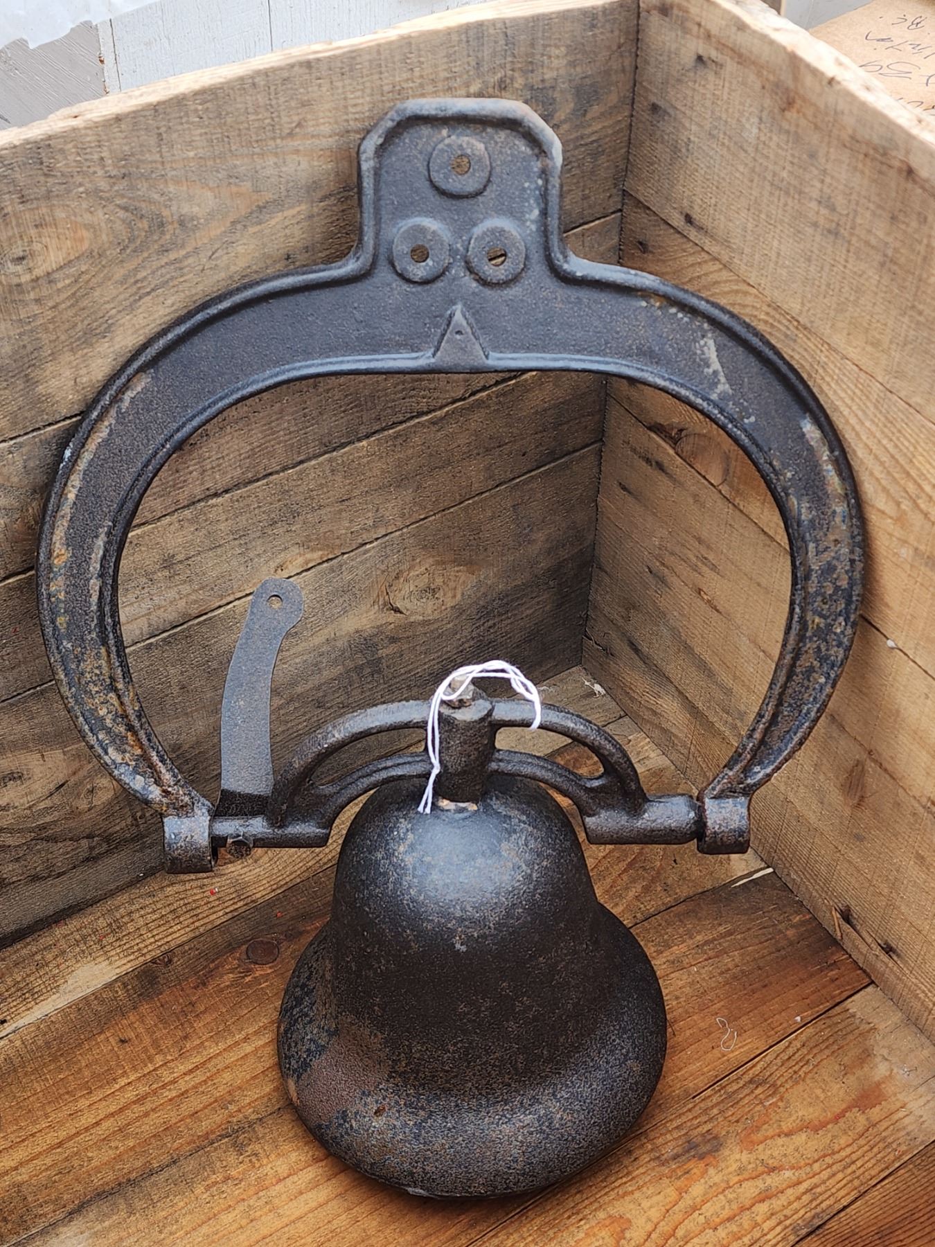 Cast iron bell, w/ holder - Schmalz Auctions