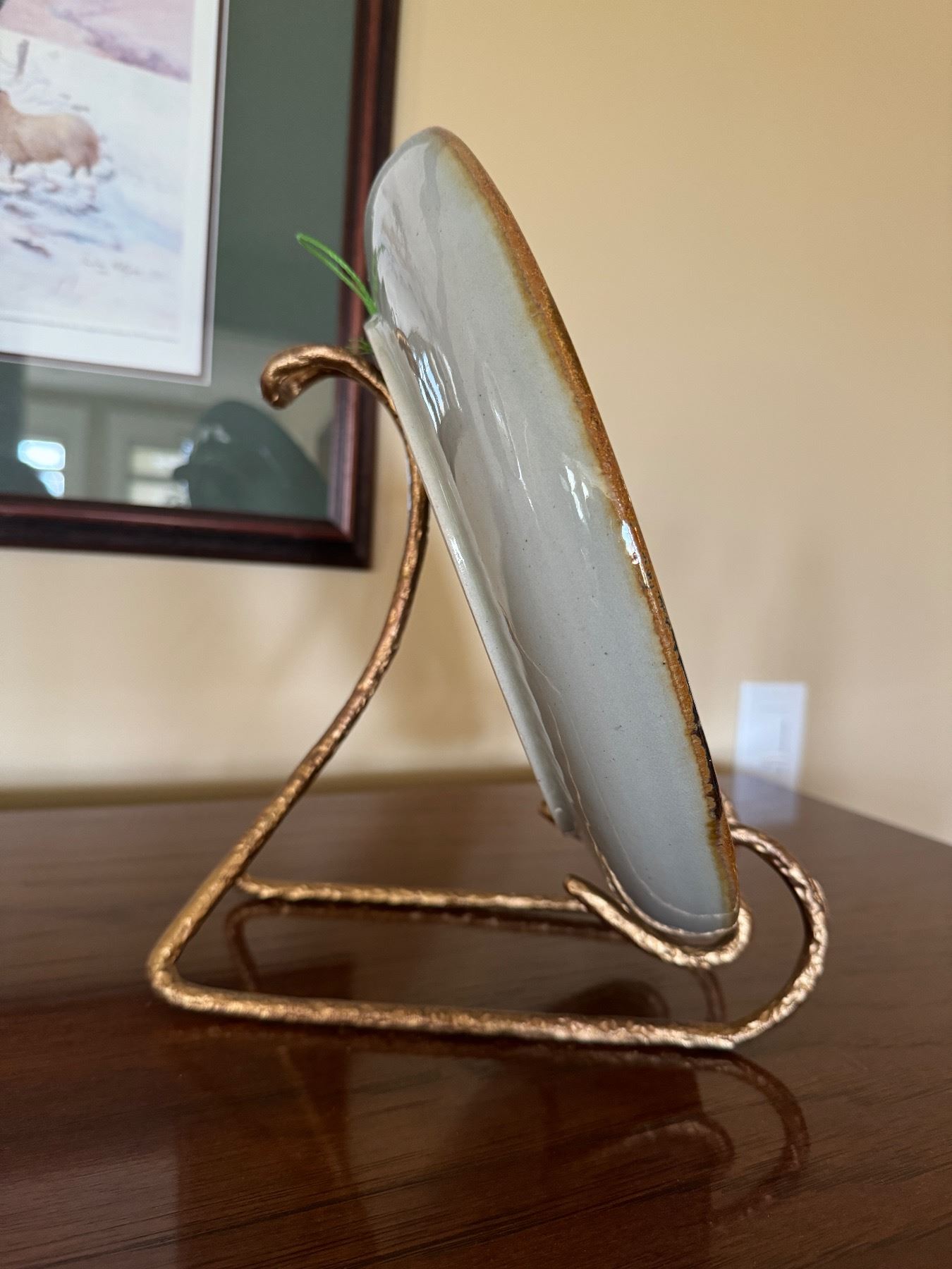 Pottery plate on stand