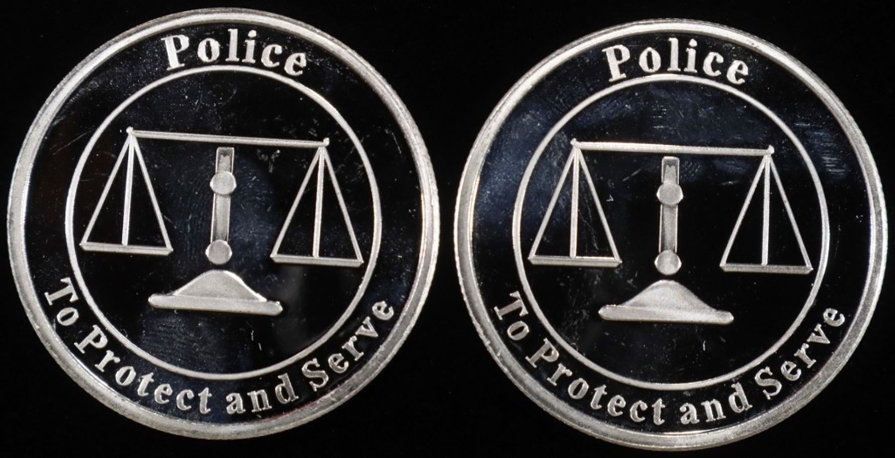 (2) 1 OZ .999 SILVER POLICE ROUNDS