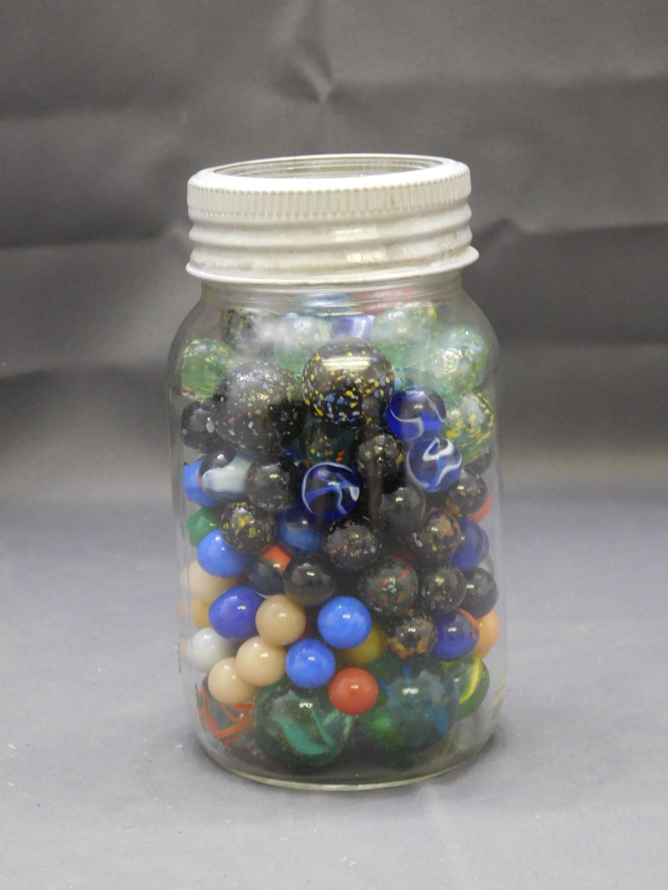 Glass Container of Marbles