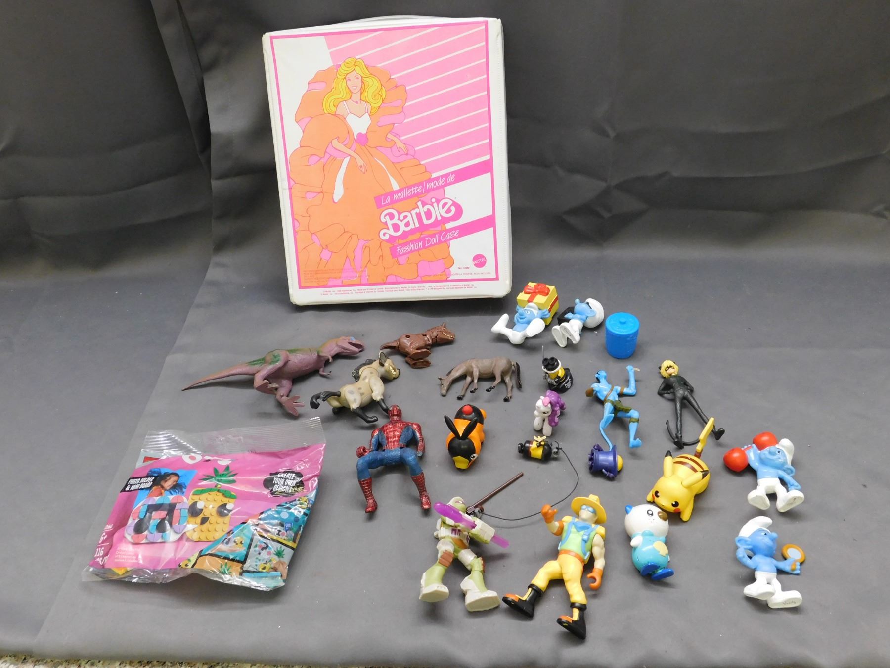 Lot of Assorted Toys, Barbie, Smurfs, Pokemon, Etc