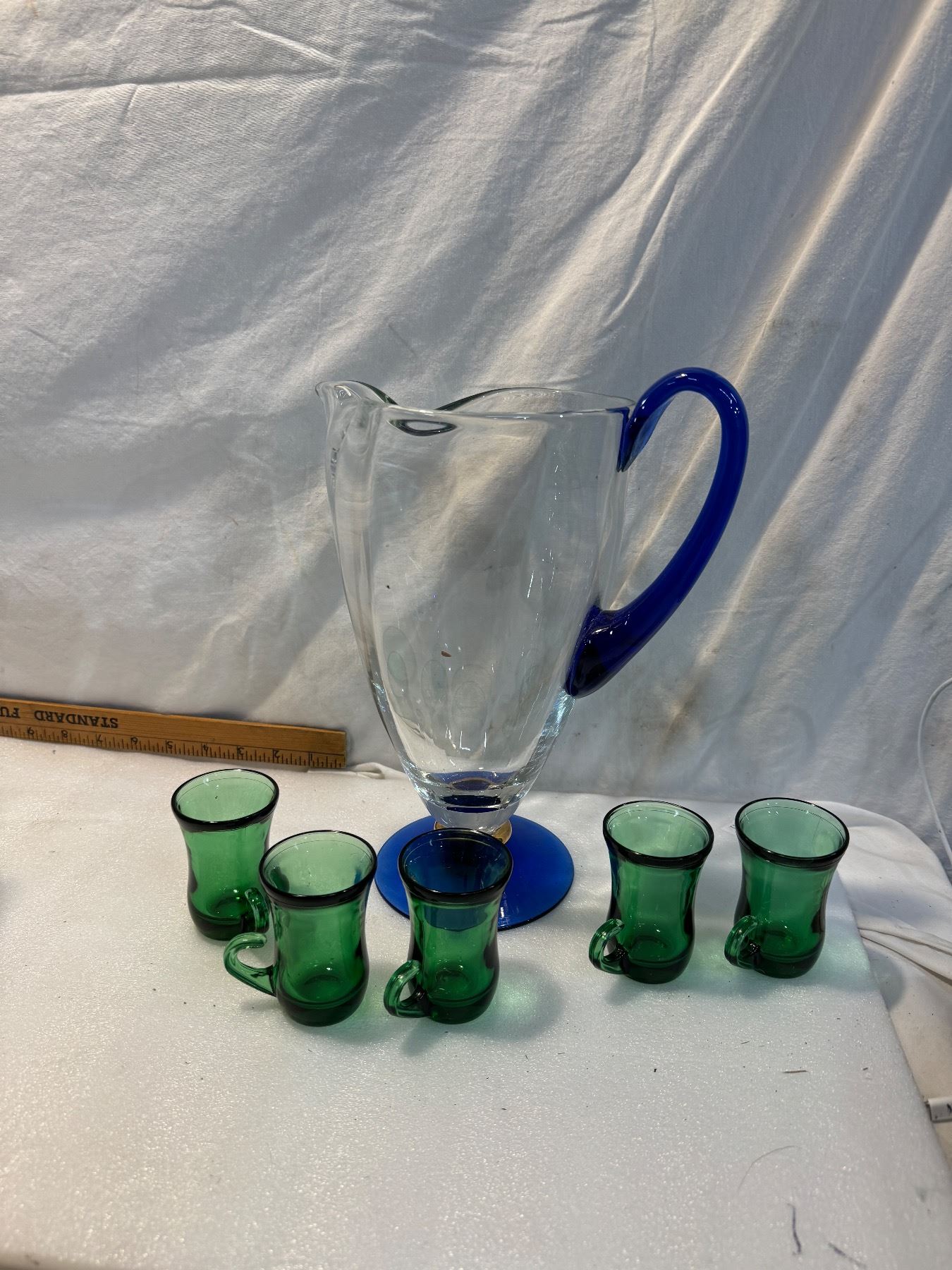 Pitchers and small glasses