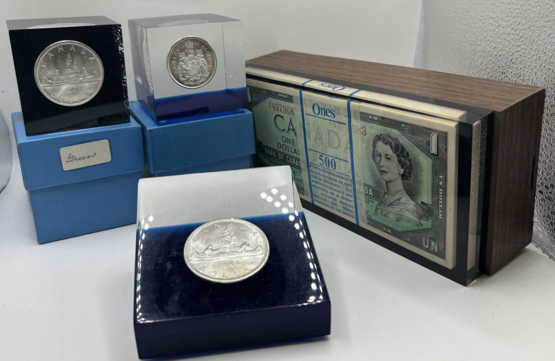 Nice lot of items in Lucite. Radio with paper money and canadian silver ...