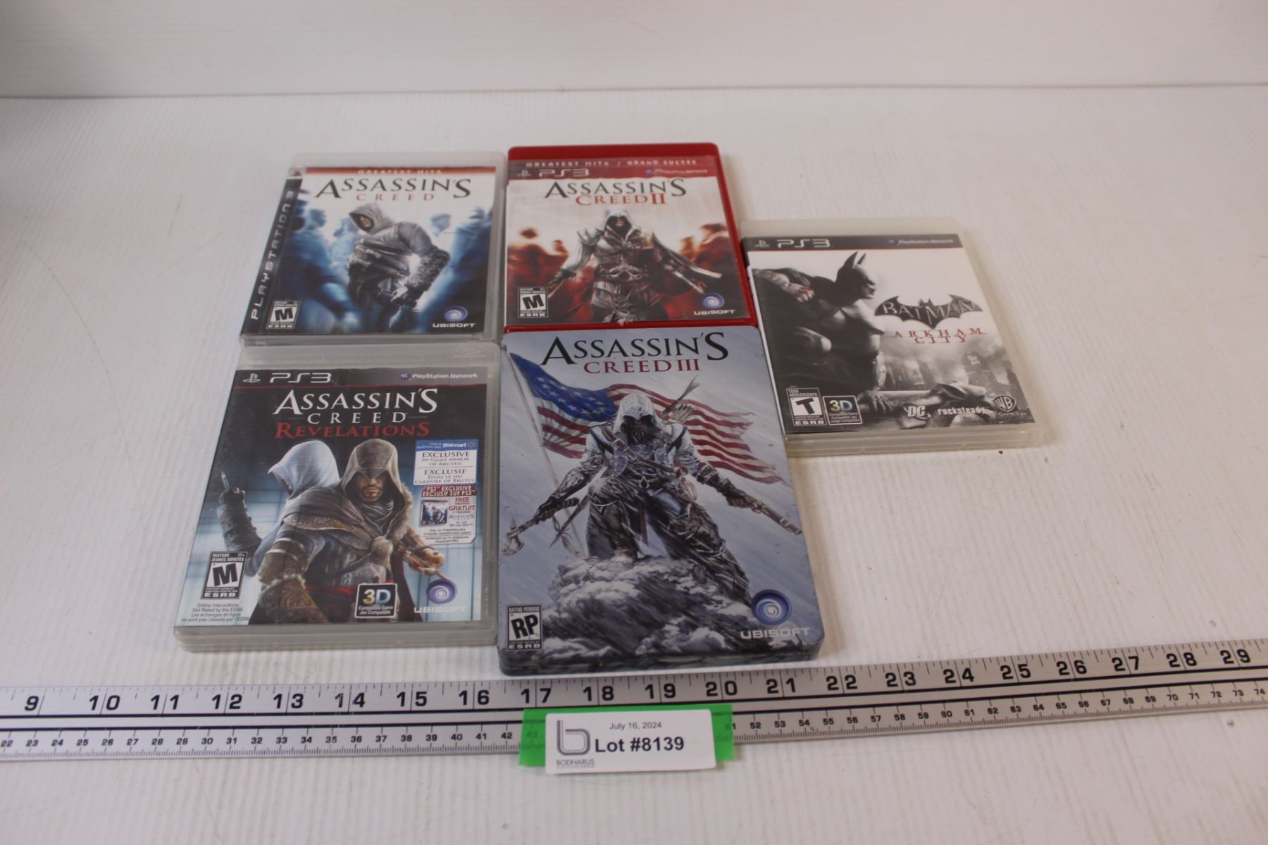(5) PlayStation 3 Games: (4) Assassin's Creed Editions & Batman Arkham City - Bodnarus Auctioneering