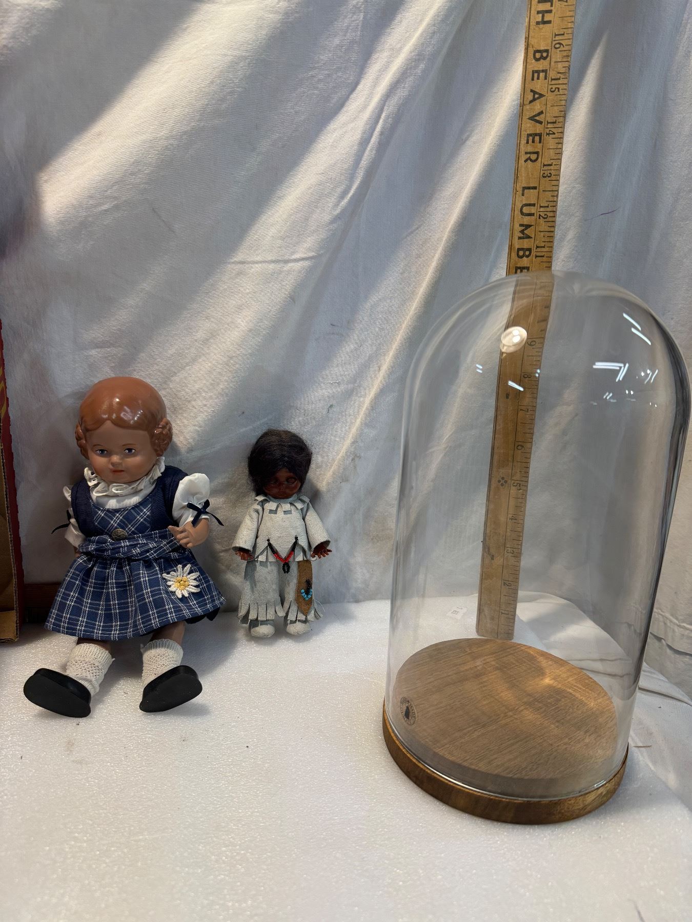 Vintage collectible dolls, and glass dome display.