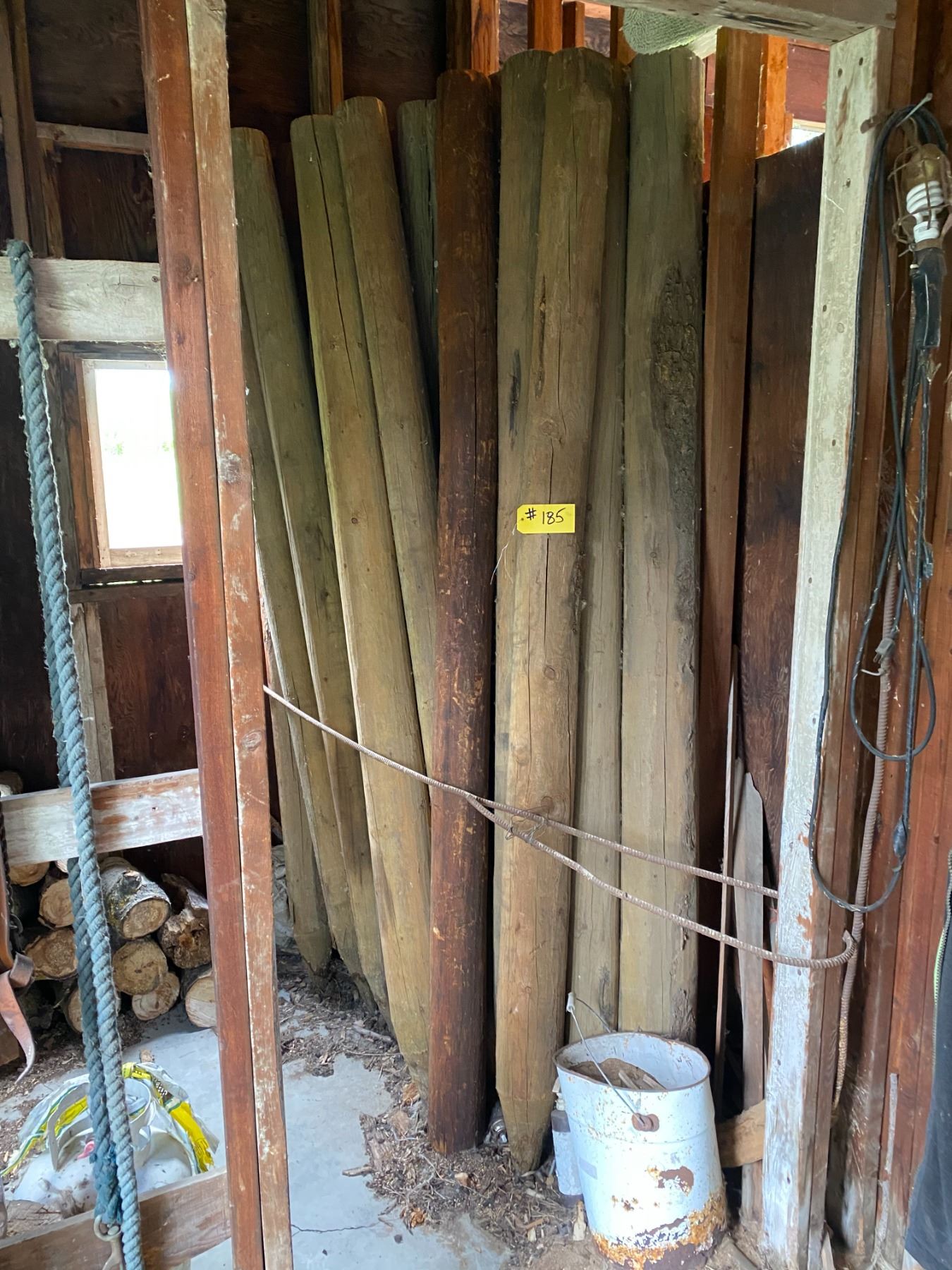 Approx. 30- 4 to 5 inch, 8 ft sharpened fence posts, sold by the pile