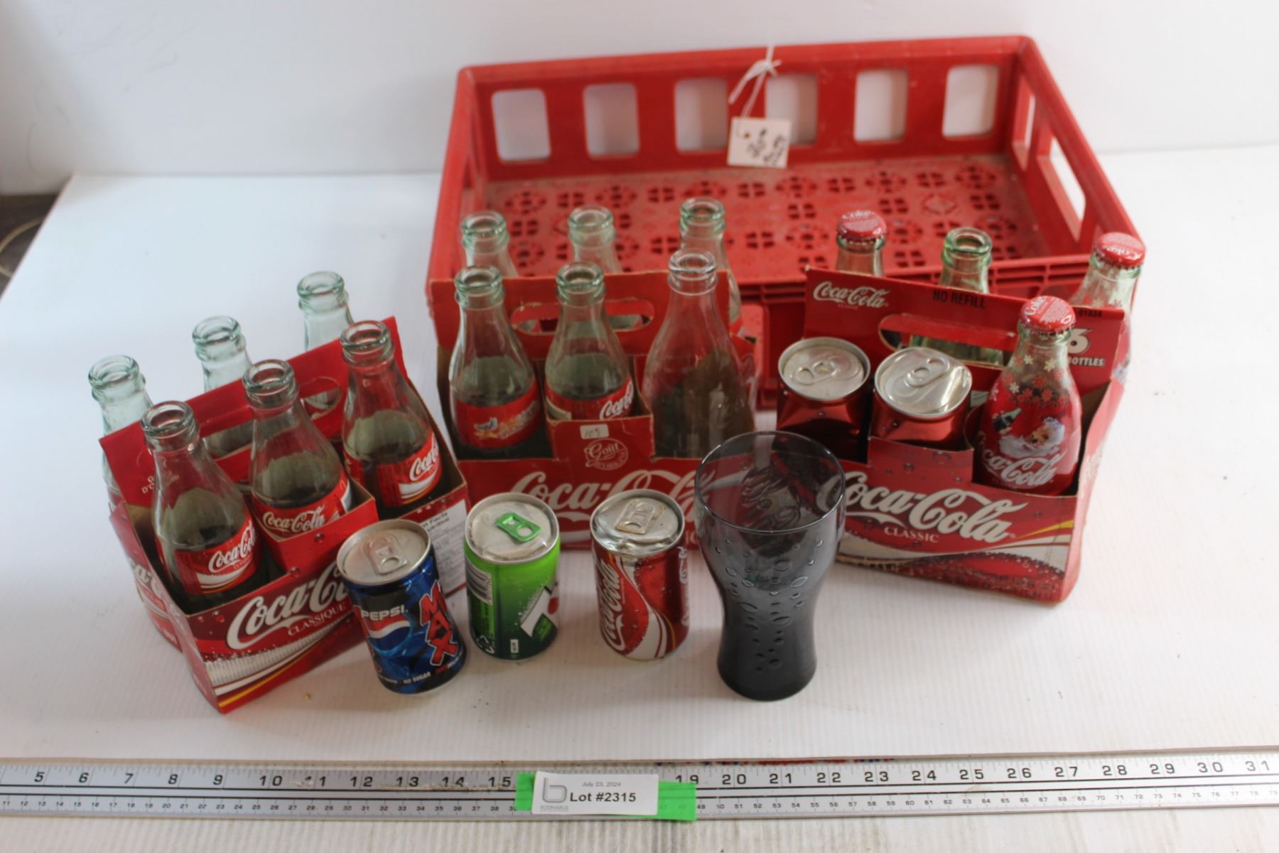 Coca Cola Bottles, Assorted Soda Cans and Plastic Coca Cola Tray Coca Cola Bottles, Assorted Soda Cans and Plastic Coca Cola Tray