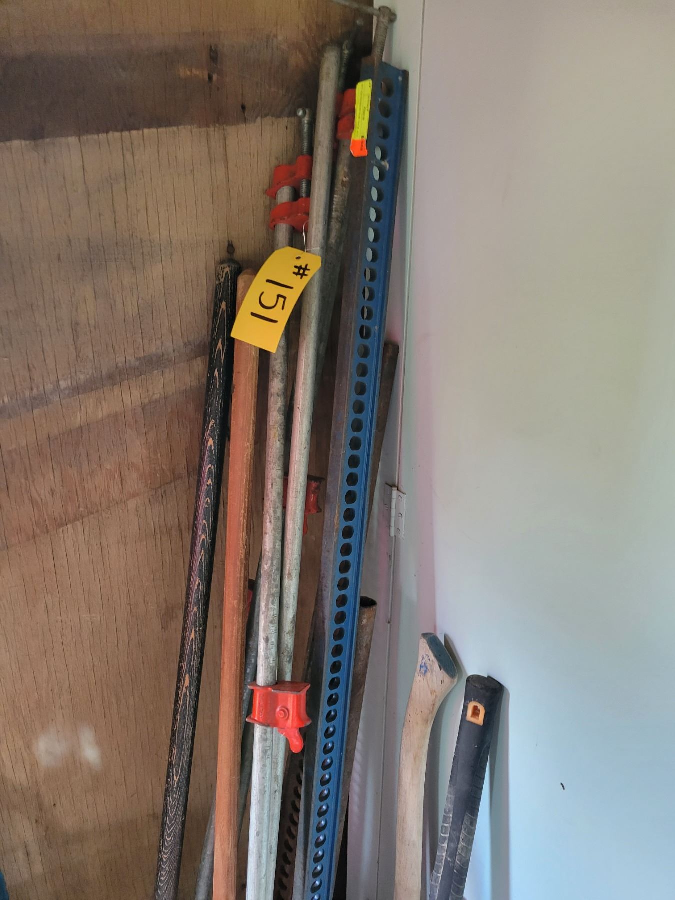 Sledge hammer, brooms, wood clamps, axe, crow bar, jackall