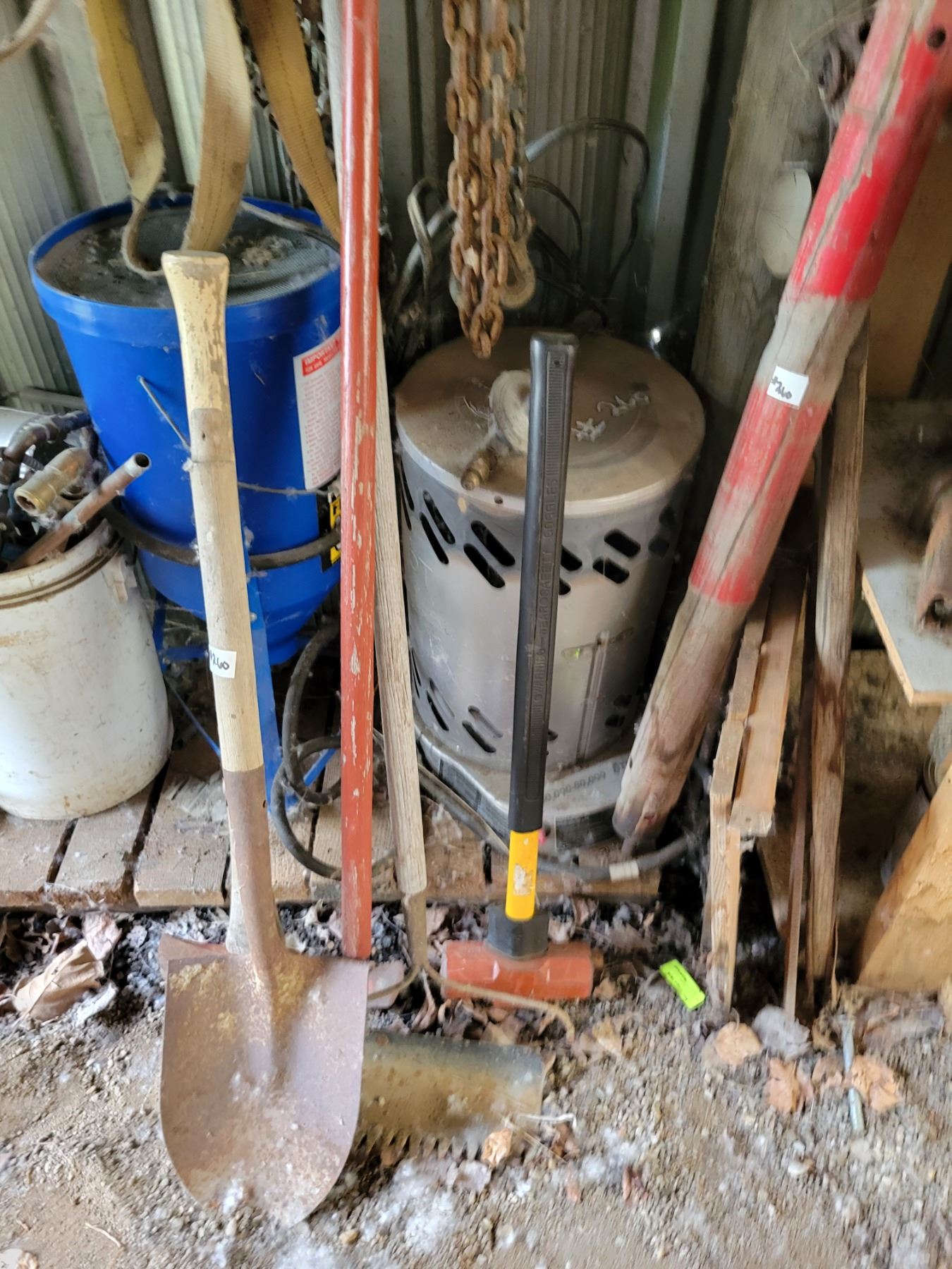 Chains, tools, heaters, straps, boomer, against the wall