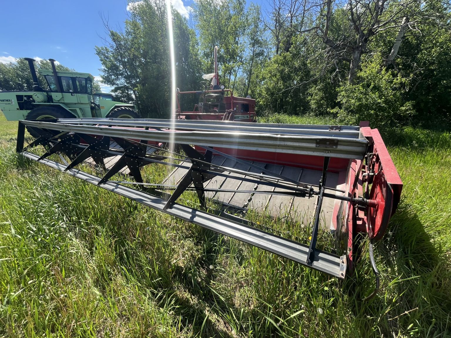 1985 International 4000 Swather with 24ft Bat Reel, Crop Dividers