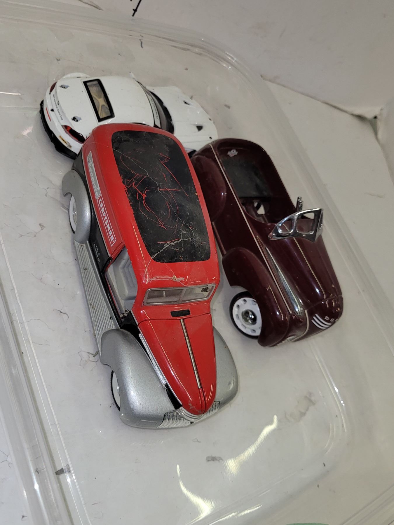 A collection of three toy vehicles/ collectables