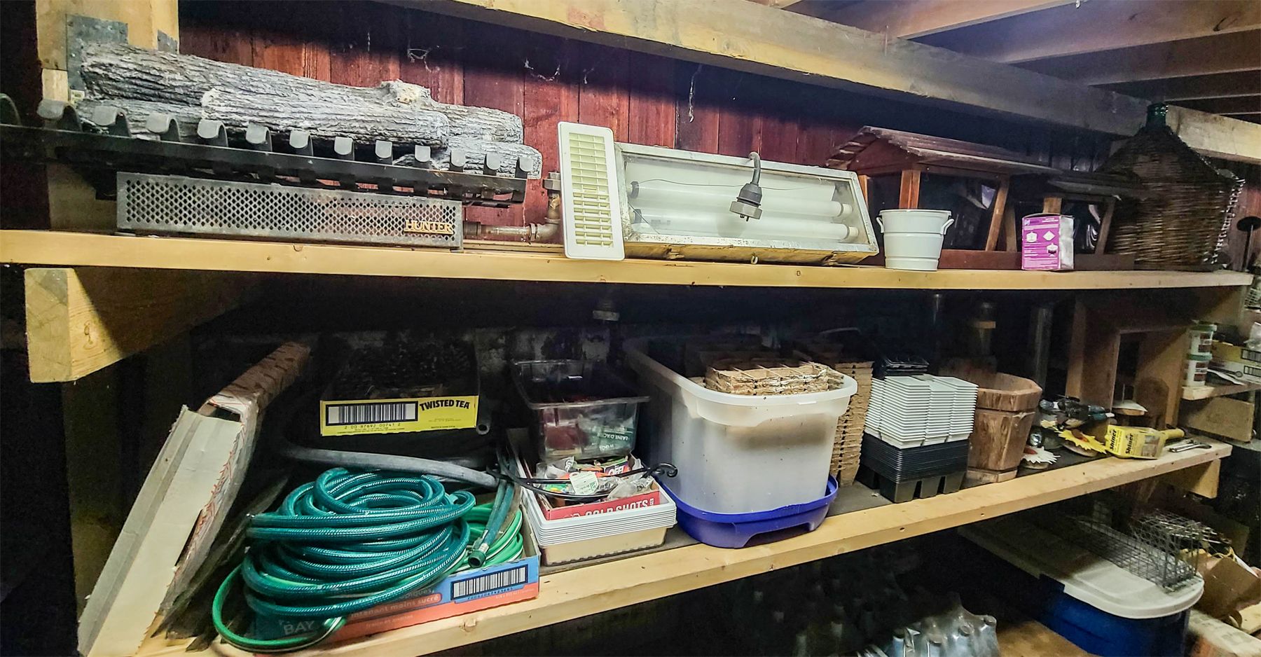 TWO SHELVES OF ASSORT. LAWN DECO & TOOLS