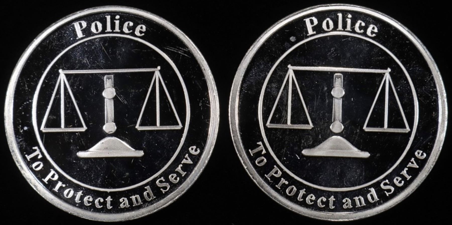 (2) 1 OZ .999 SILVER POLICE ROUNDS
