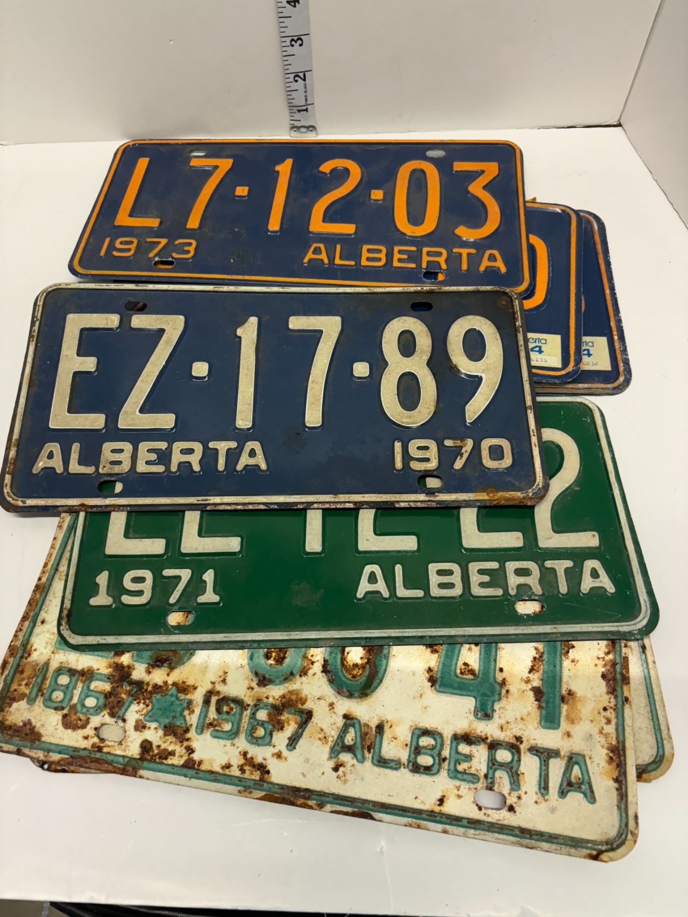 Seven Vintage Alberta License Plates