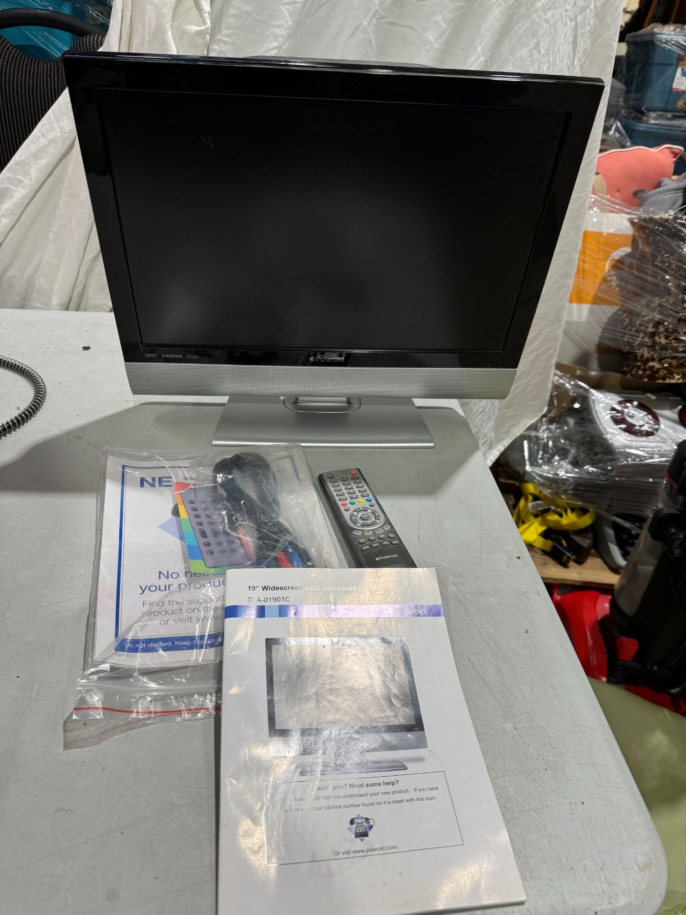 Polaroid 19 inch wide screen LCD television with remote no power cord