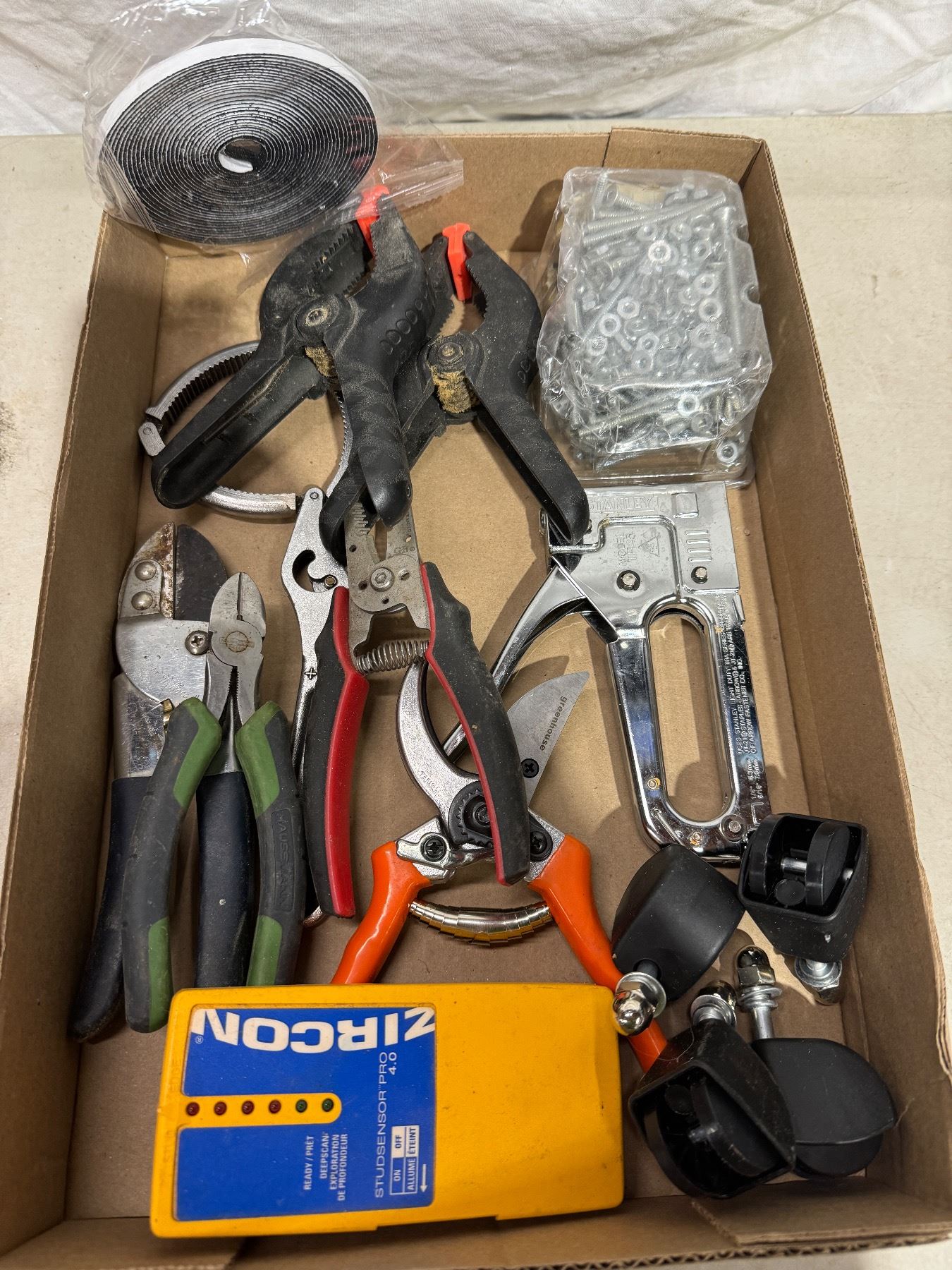 Assorted tools, stapler, clamps