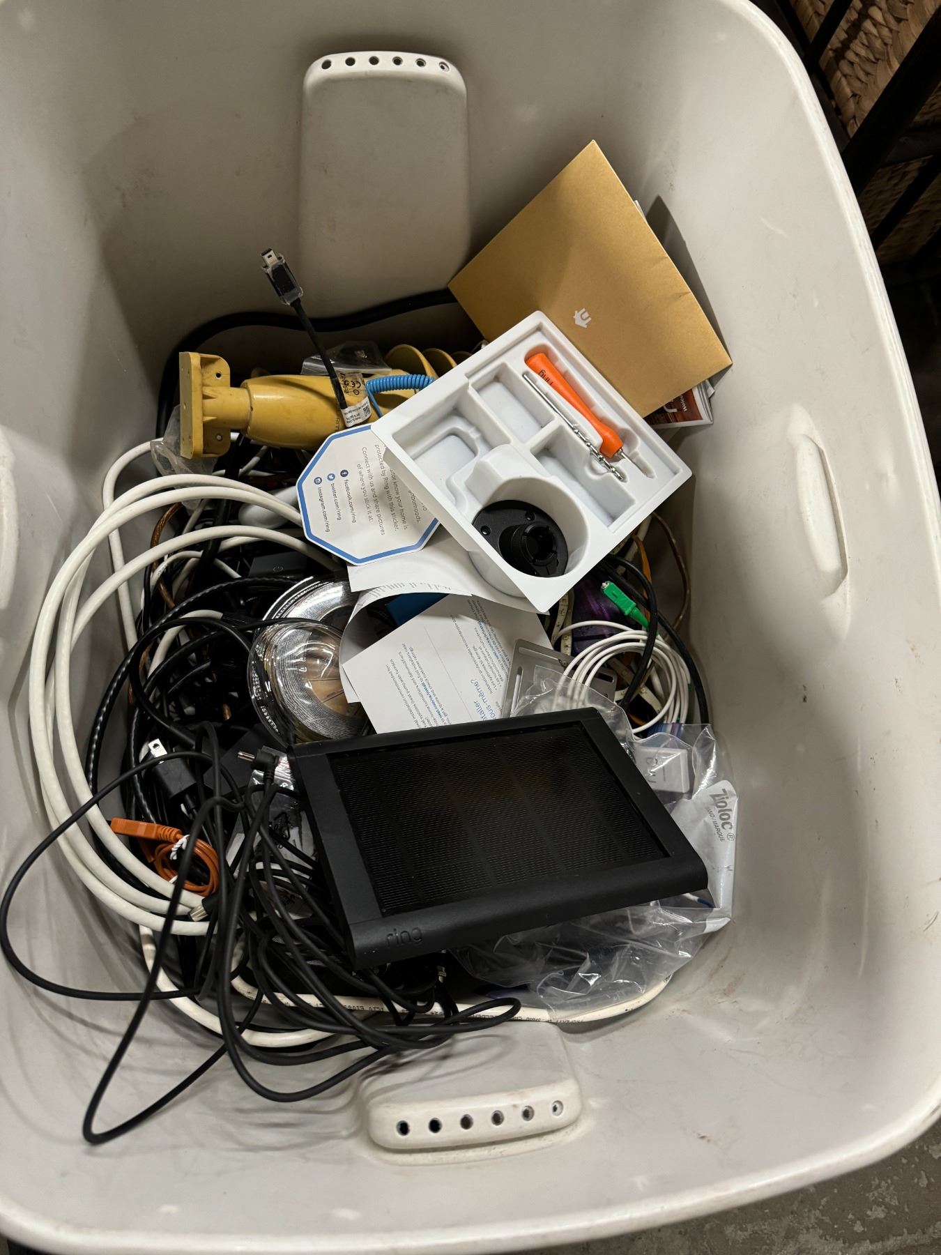 Bin of electronics and assorted items
