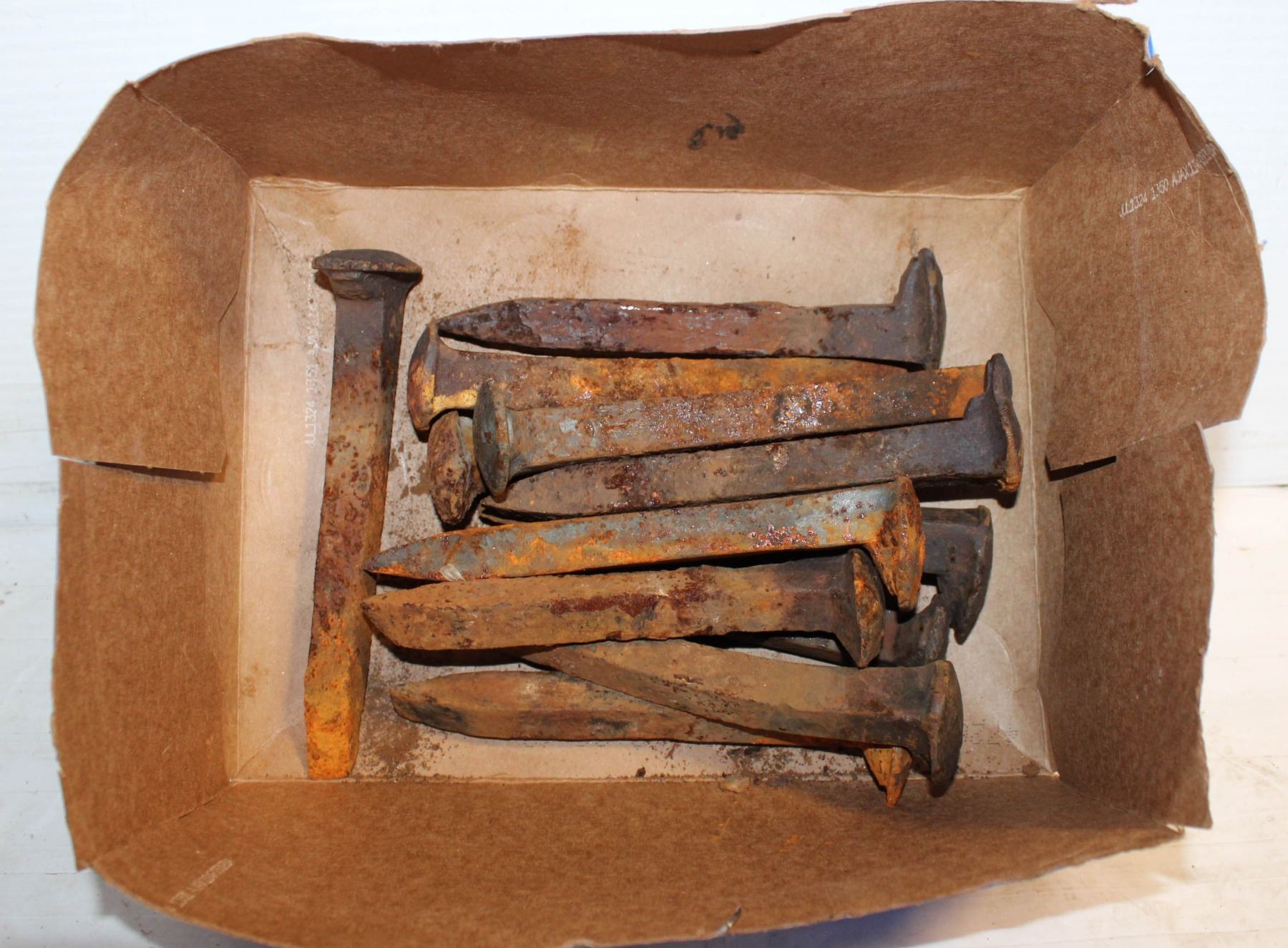 ANTIQUE CAST IRON RAILROAD SPIKES SET OF 12