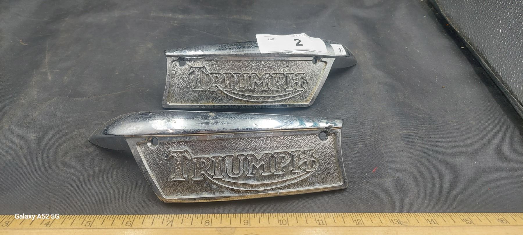 Pair of vintage Triumph motorcycle tank badge emblems