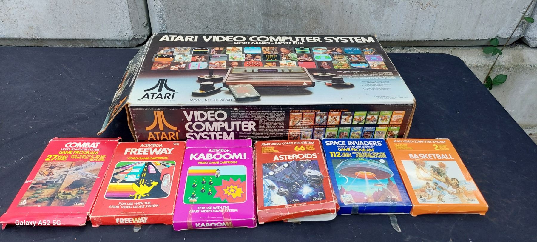 Vintage in box Atari 2600 console with various boxed games