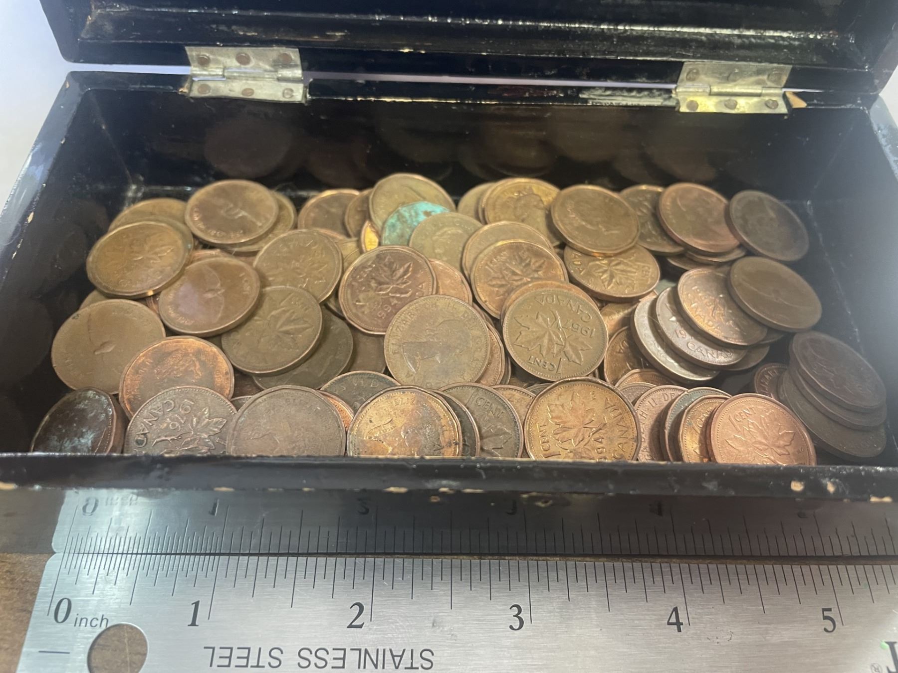 Wood Container full of Canadian Pennies