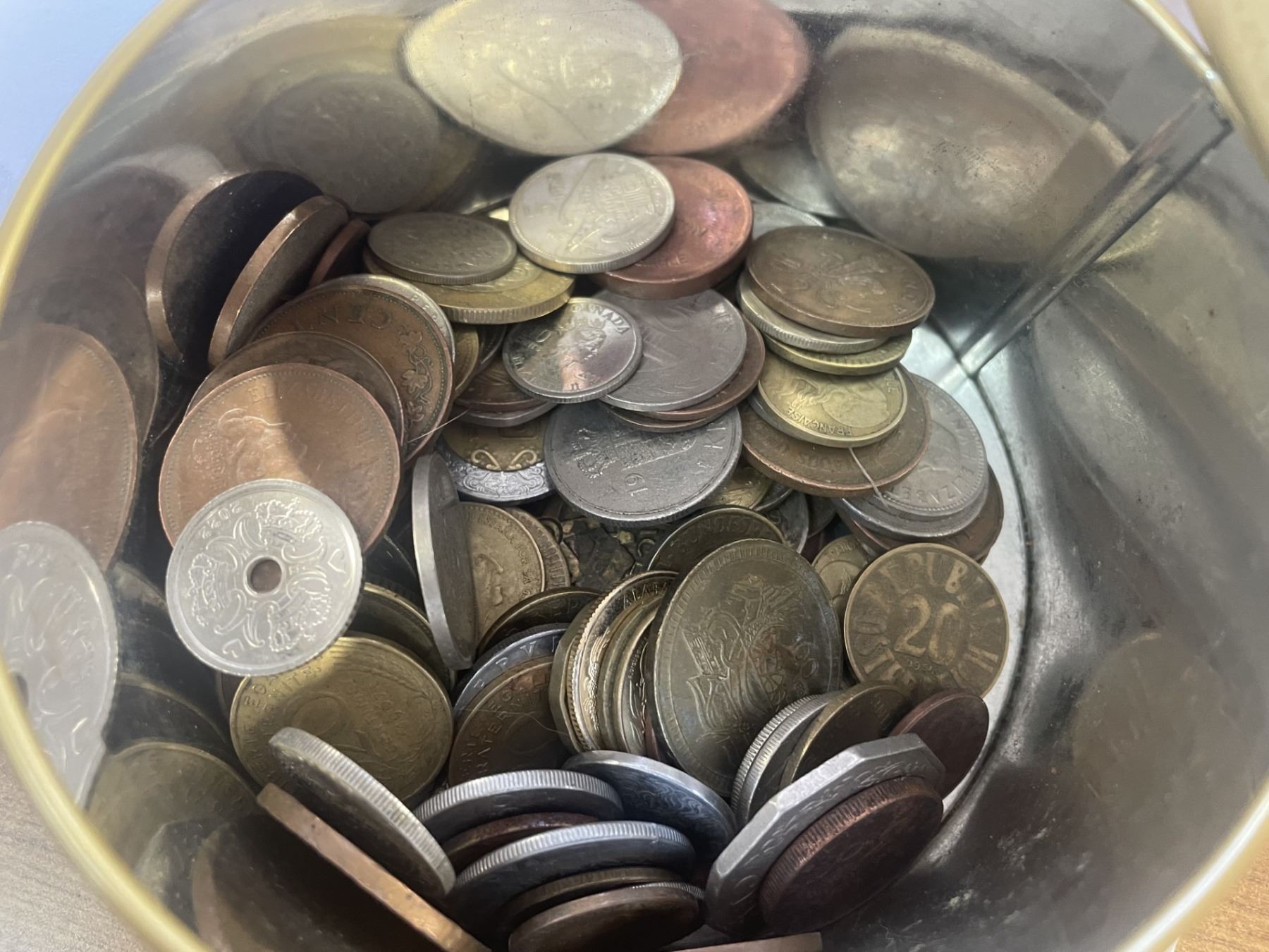 Decorative Tin full of Foreign Coins