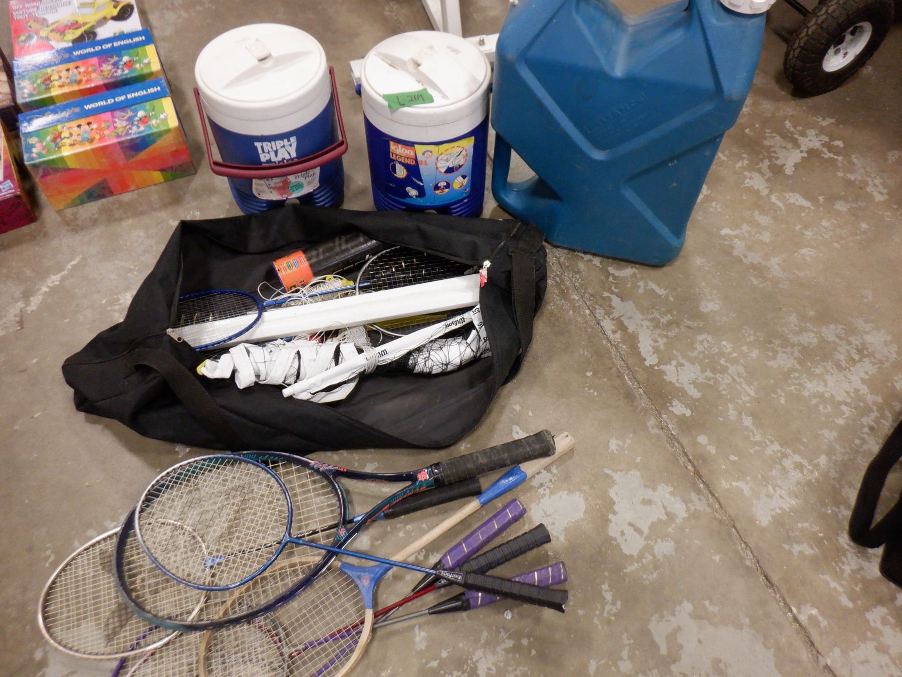 Large lot of outdoor sporting good items including badminton net and ...