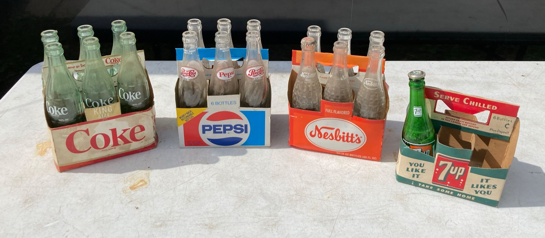 VINTAGE SODA BOTTLES AND VINTAGE SIX PACK CARRIERS - Cornerbids VINTAGE SODA BOTTLES AND VINTAGE SIX PACK CARRIERS - Cornerbids