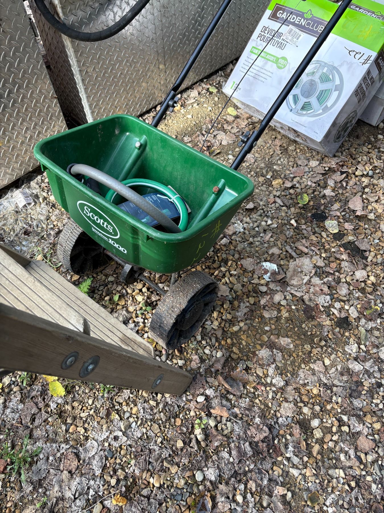 Step ladder ( 6ft) spreader. 2- hose reels, tire tube.
