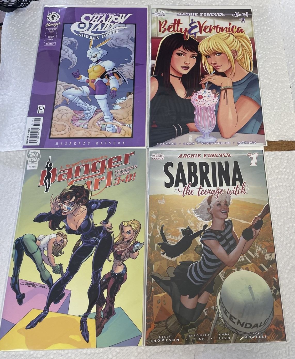 Four comics, Various Publishers, Sabrina, Betty and Veronica, Shadow ...