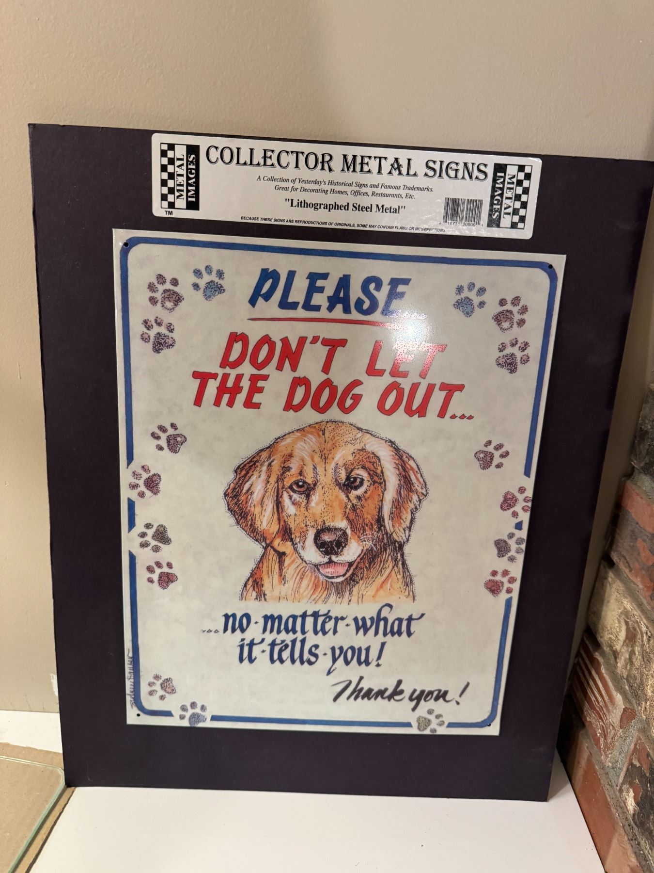 Please don't let the dog out tin sign