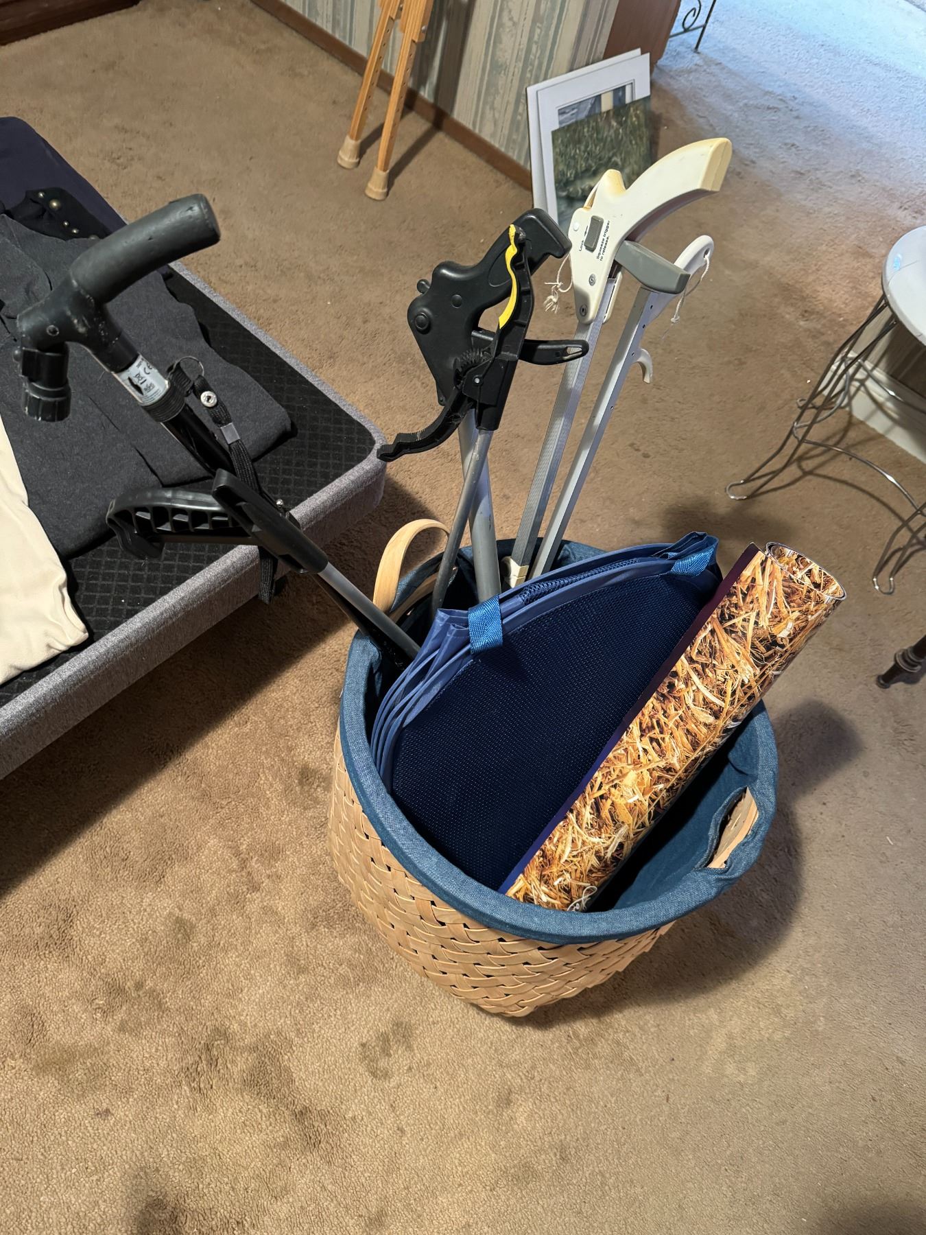 Laundry basket, cane, and pickers