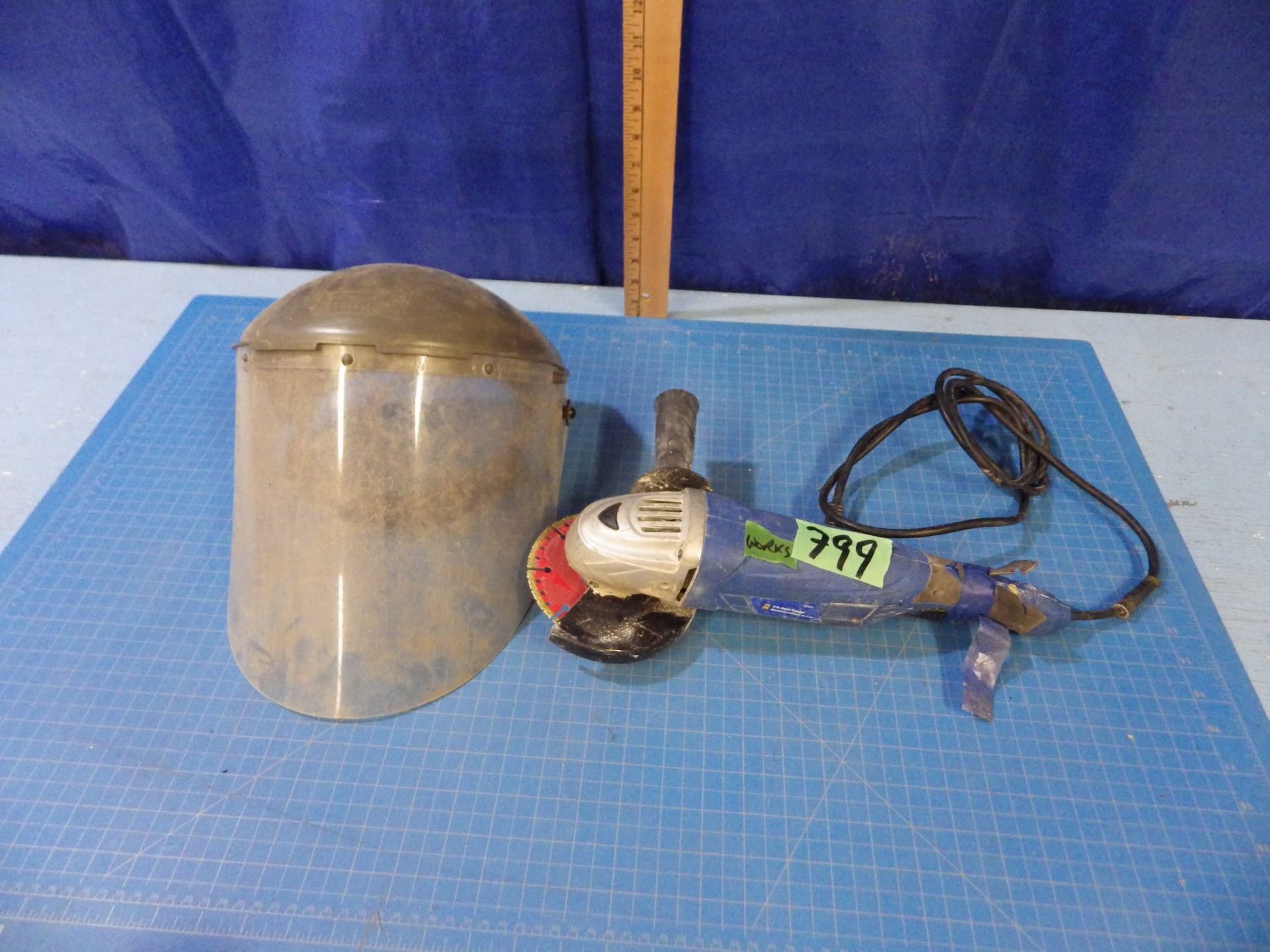 Angle grinder and face shield