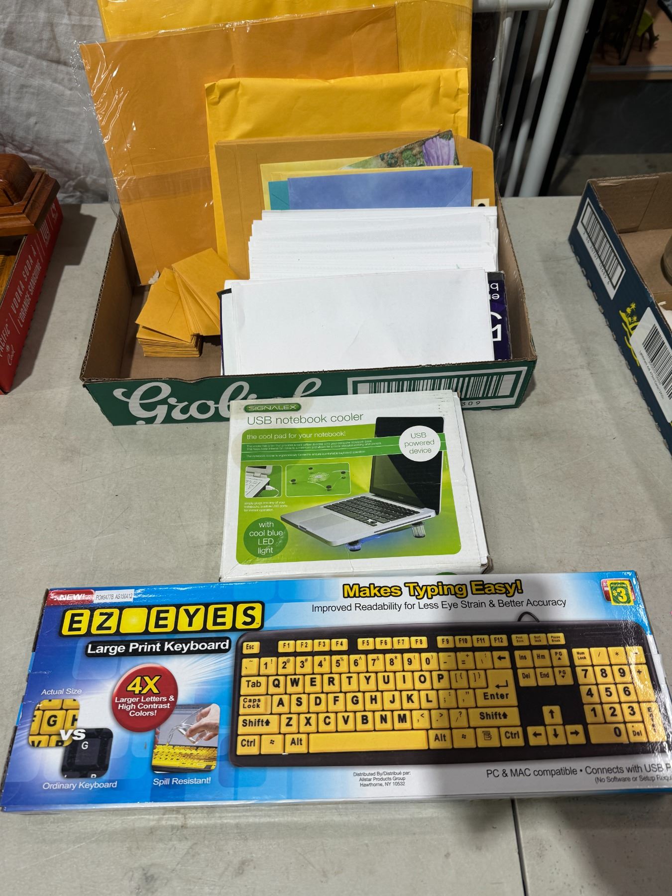 Envelopes, keyboard and notebook cooler