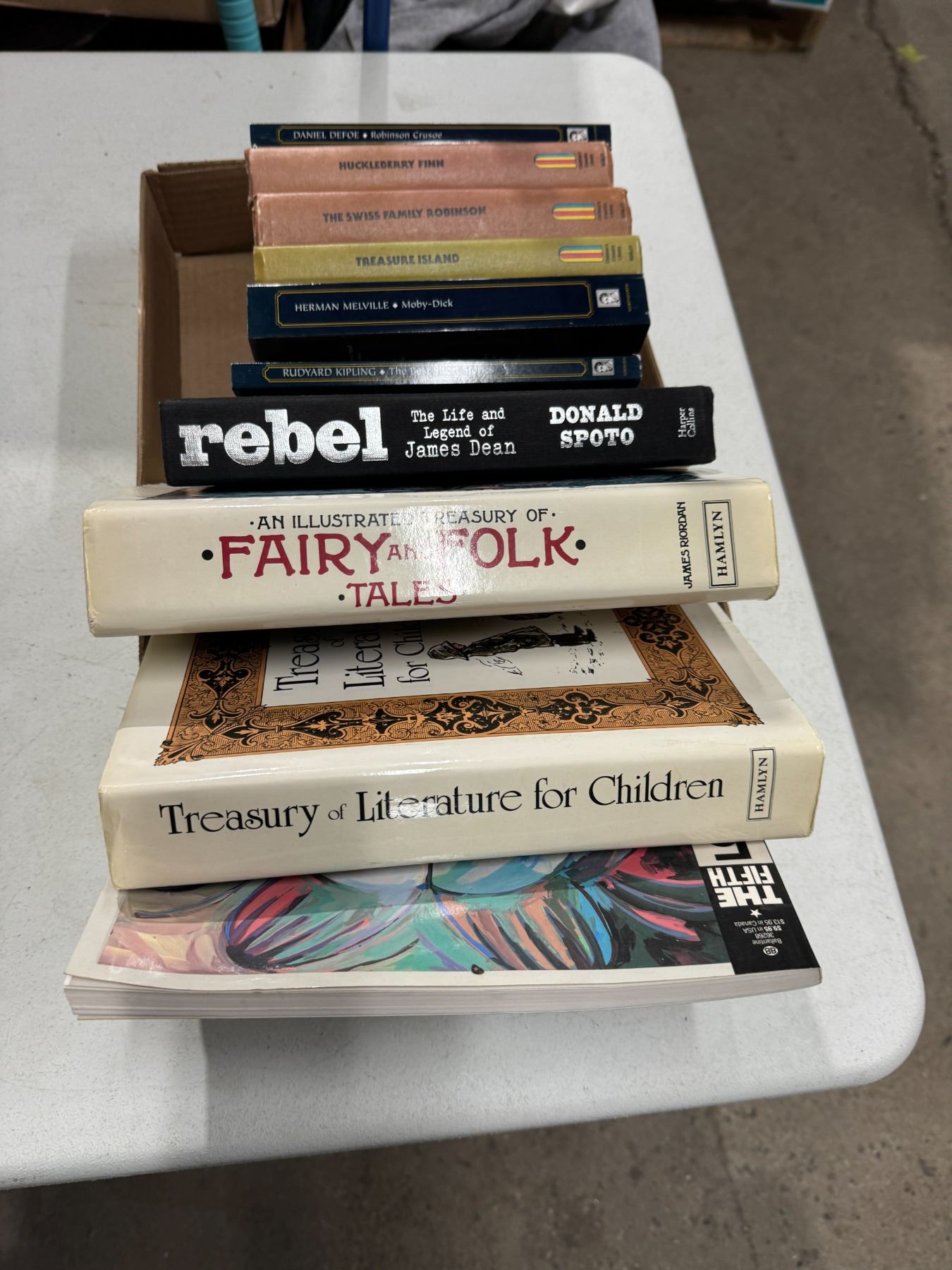 Books, Huckleberry Finn, Swiss family Robinson treasure Island, etc.