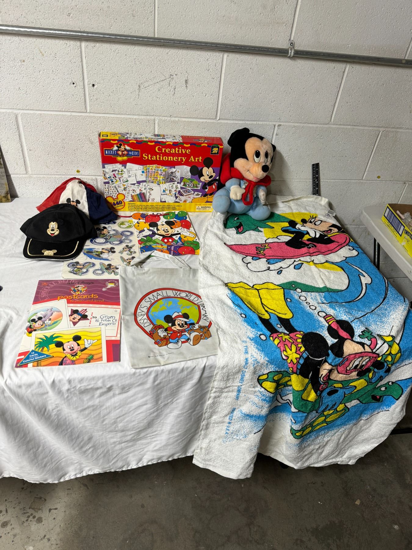 Mickey mouse collectibles hats, beach towel, stationary art, etc.