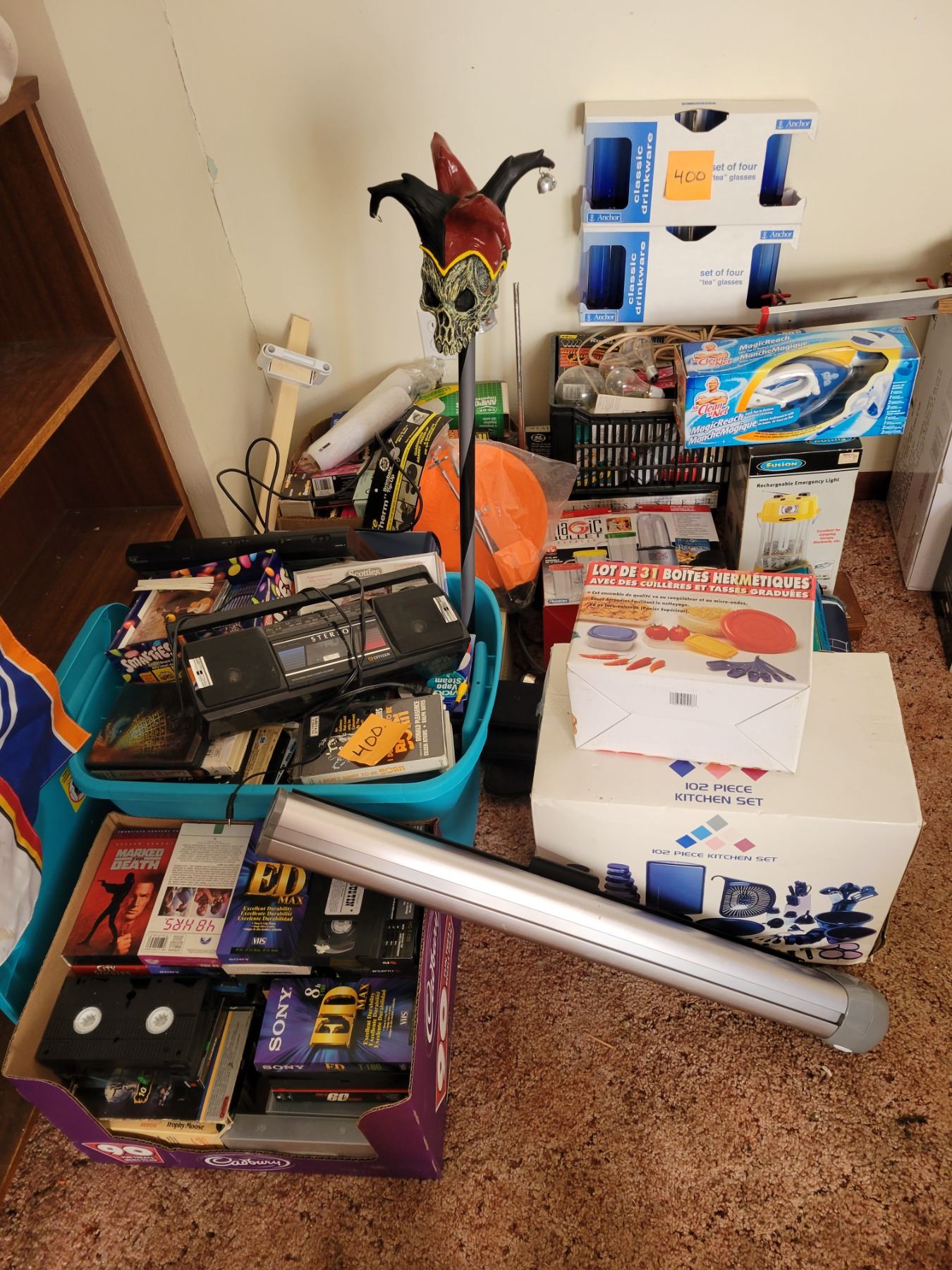 Qty of VHS, CDs, DVDs, light bulbs, kitchen wear, cleaning supplies ...