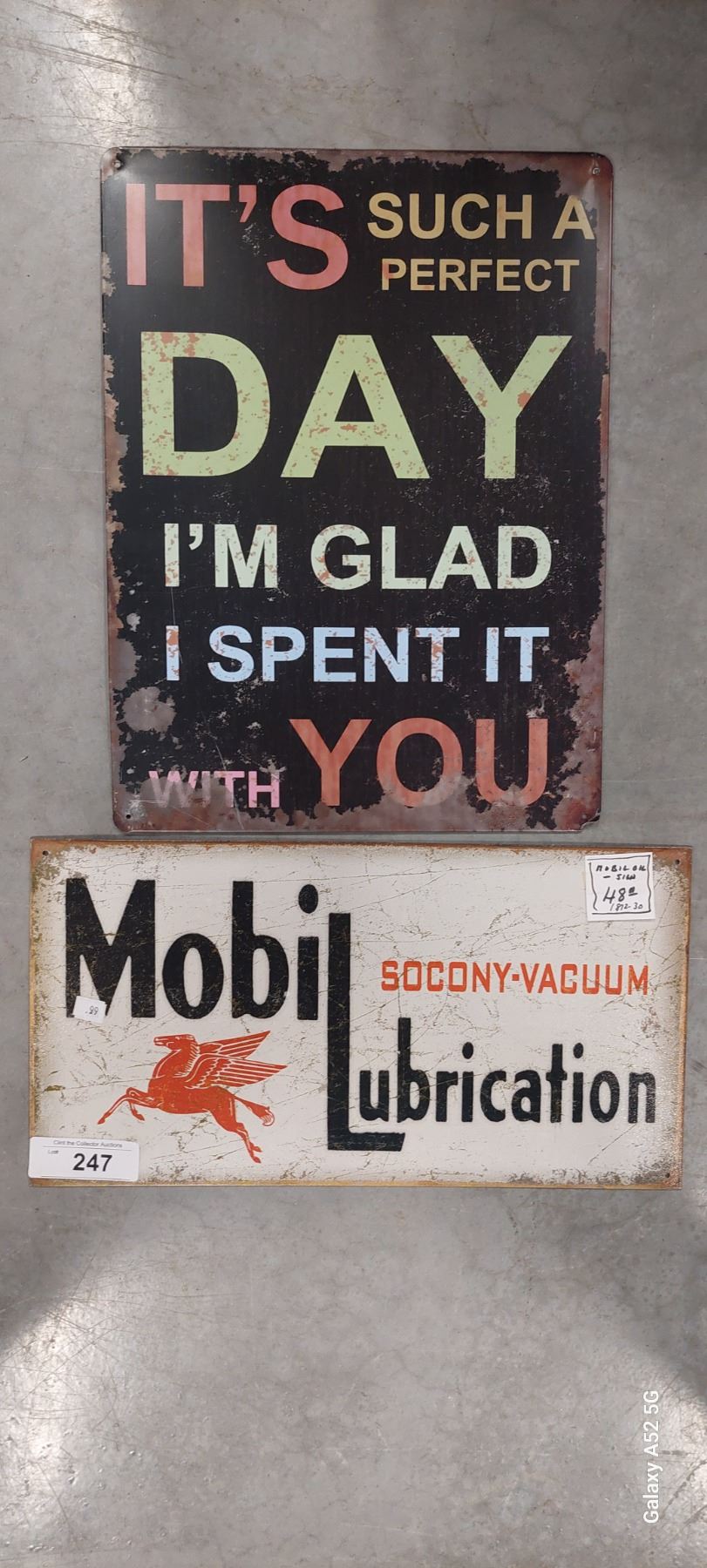 Pair of metal signs
