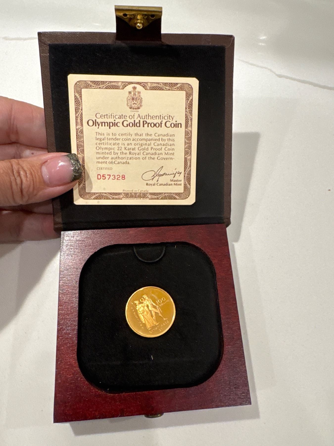 Olympic gold proof coin 22 karat gold proof$100 coin