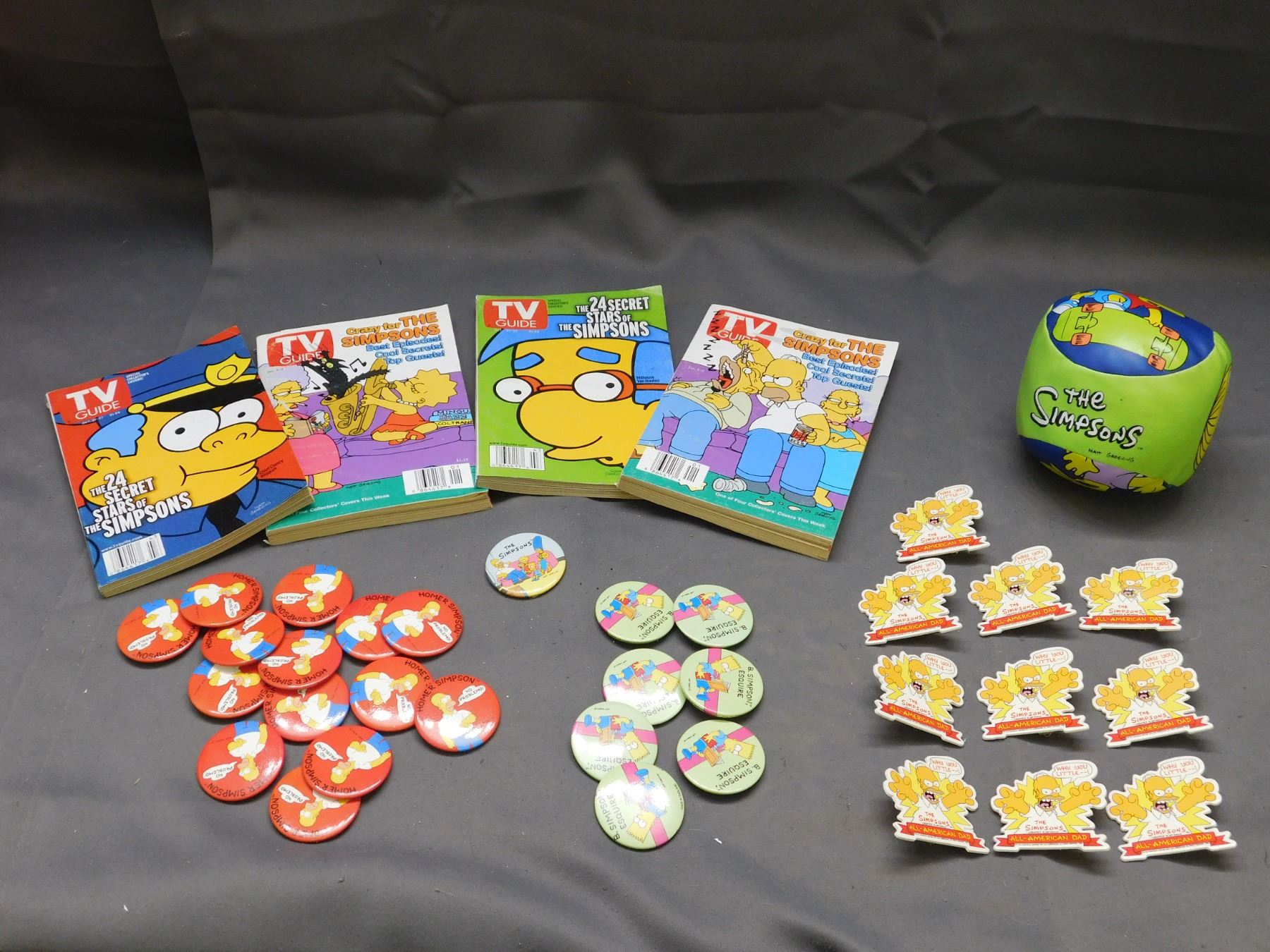 Lot of The Simpsons TV Show Memorabilia Buttons, TV Guides, Soft Ball, Pin