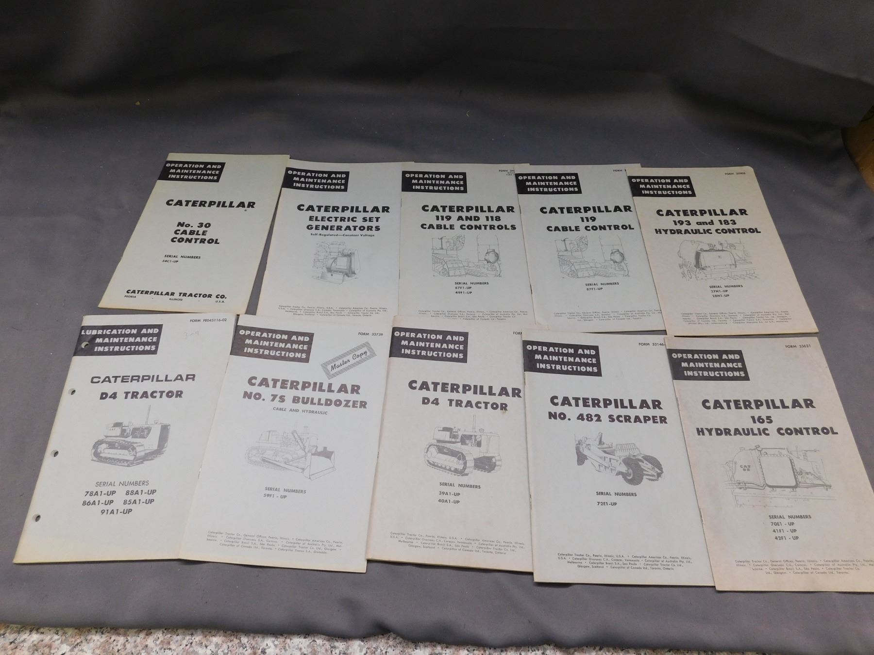 Lot of 10 Caterpillar Operation and Maintenance Instruction Books
