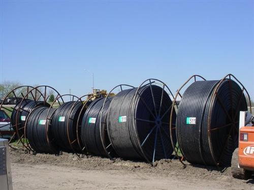 (6) SPOOLS OF 1in. - 2in. POLY PIPE (APPROX 7,000ft. PER SPOOL)