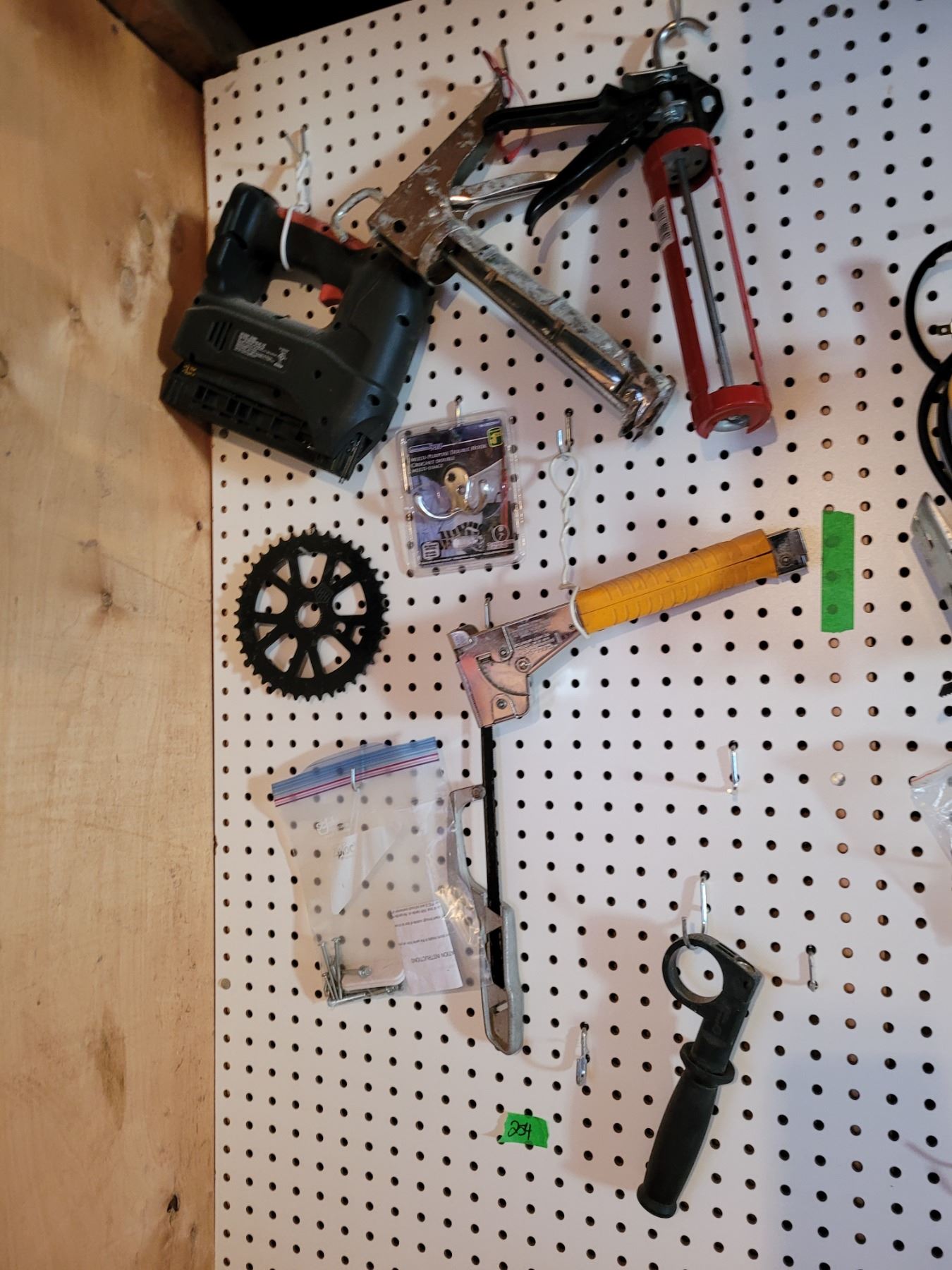 Contents on Left Side of Peg Board - Mouse Sander with Bag of New ...