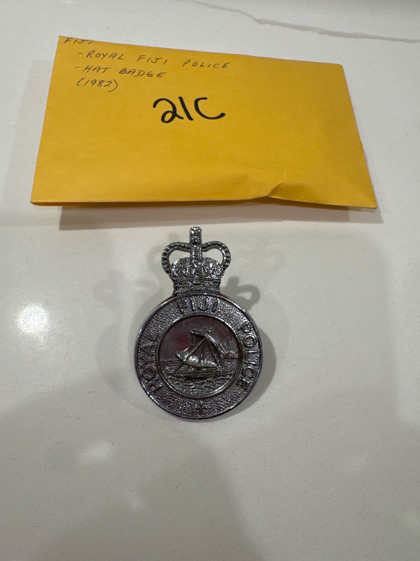Royal Fiji police hat badge