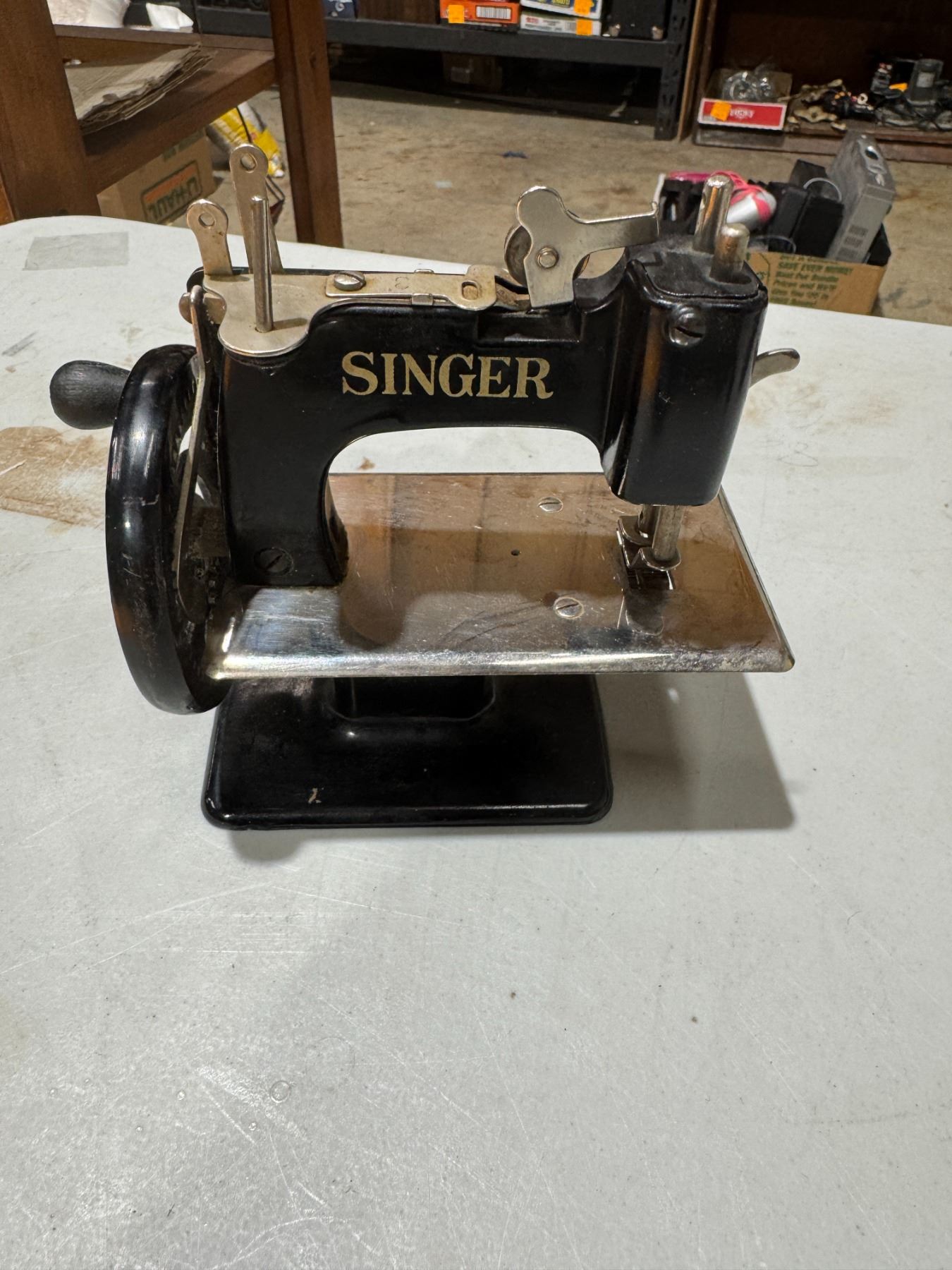 Singer hand, turning sewing machine