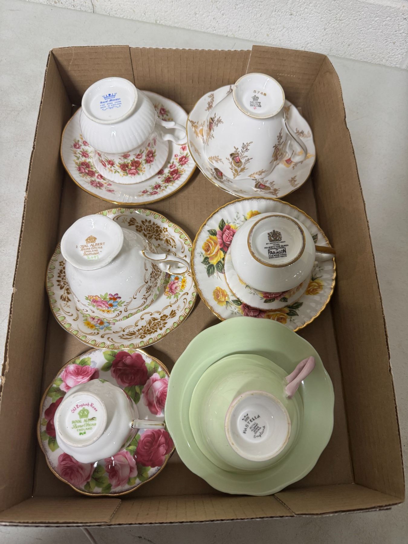 Assorted tea, cups, and saucers